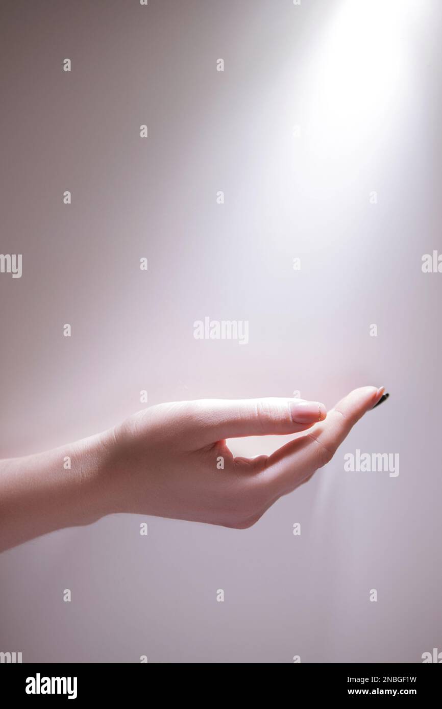 hand glowing light prayer faith miracle Stock Photo - Alamy