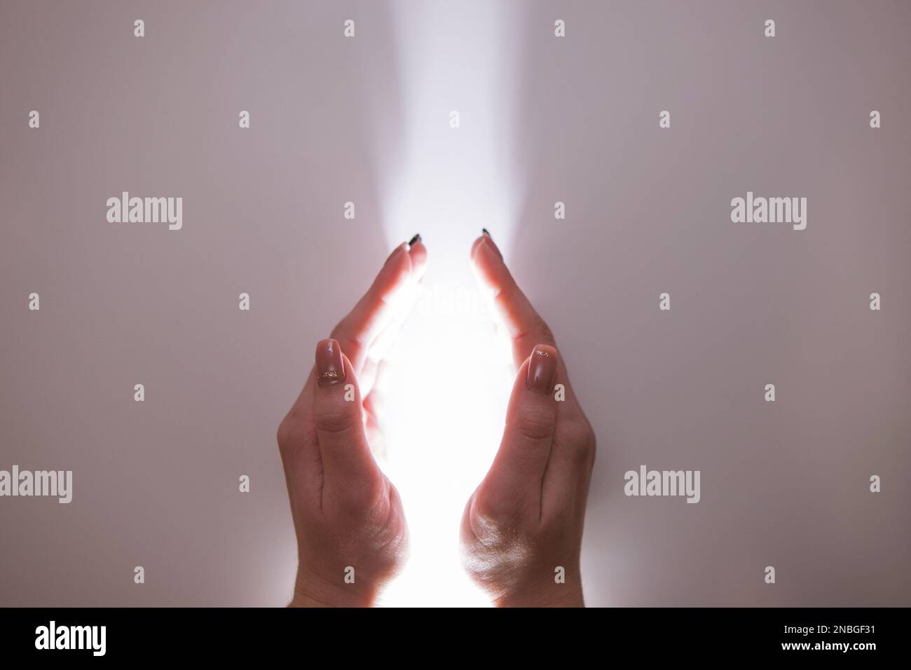 hands reach holy light miracle god religion Stock Photo - Alamy