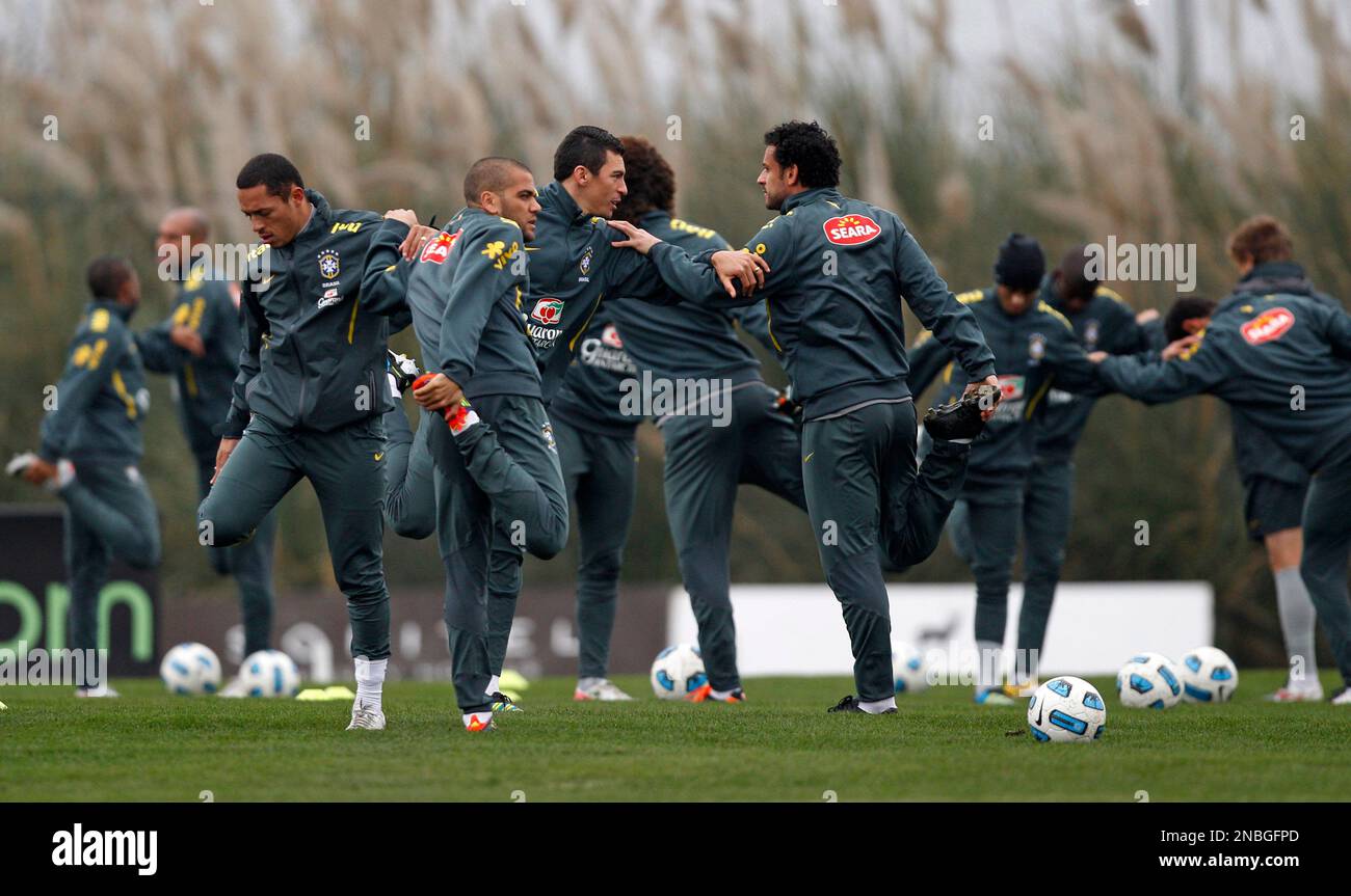 Brazil's players stretch during a training session near Campana ...