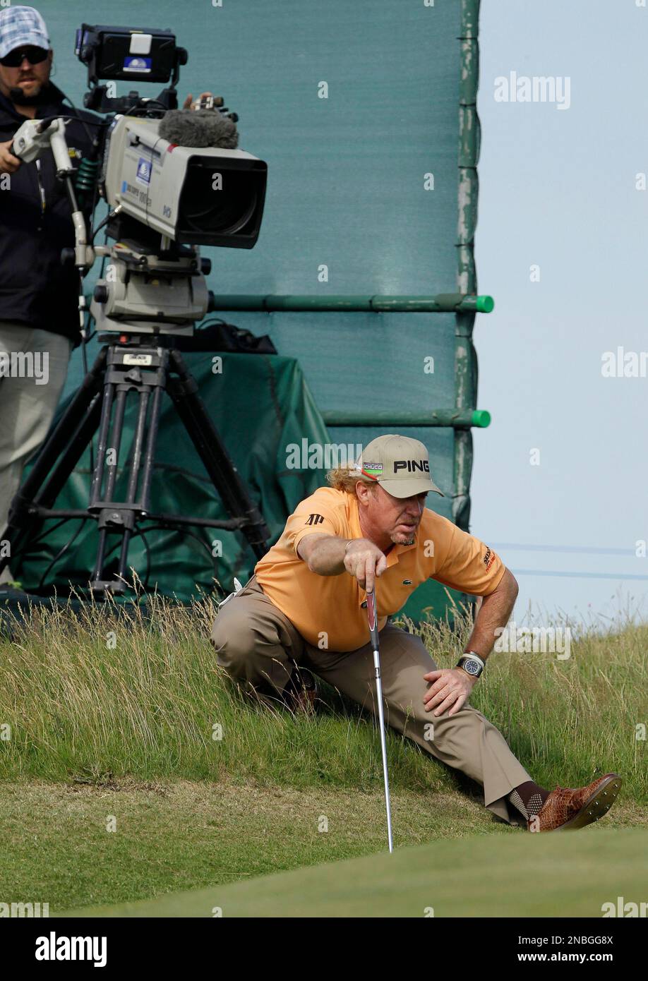 Spain's Miguel Angel Jimenez lines up a putt on the 11th green during ...