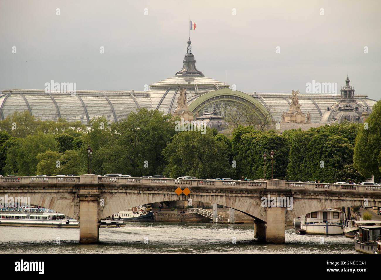 A drone shot of the Bridge of Concord over the Seine with the Grand ...