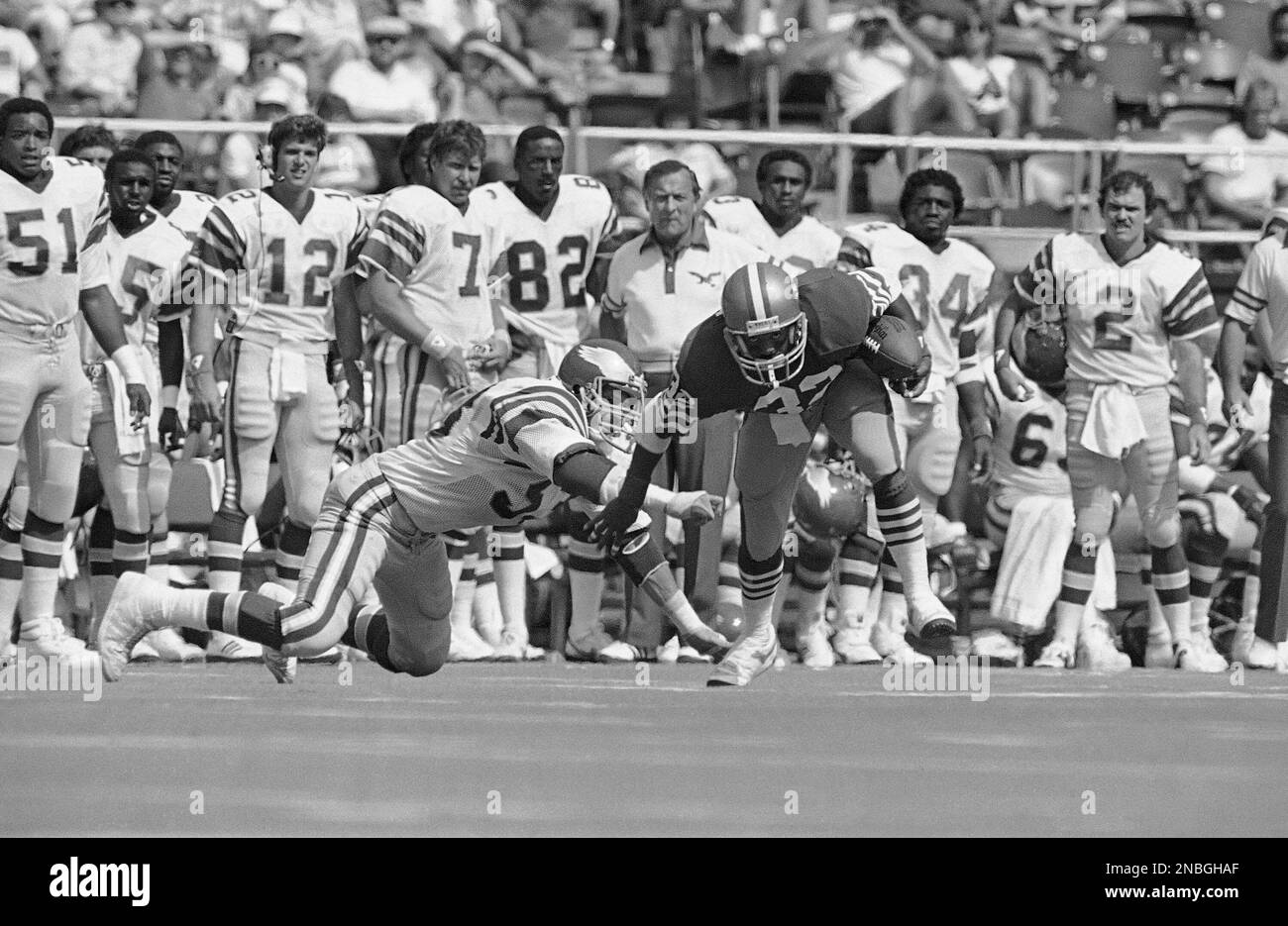 San Francisco 49ers' Carl Monroe scrambles to evade a tackle by ...