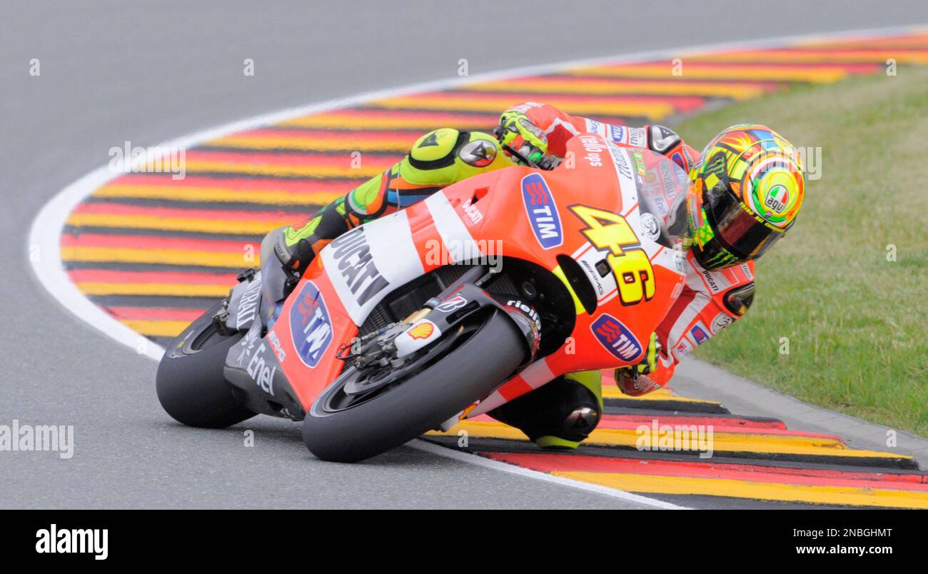 Ducati rider Valentino Rossi from Italy cuts a curve during the first ...