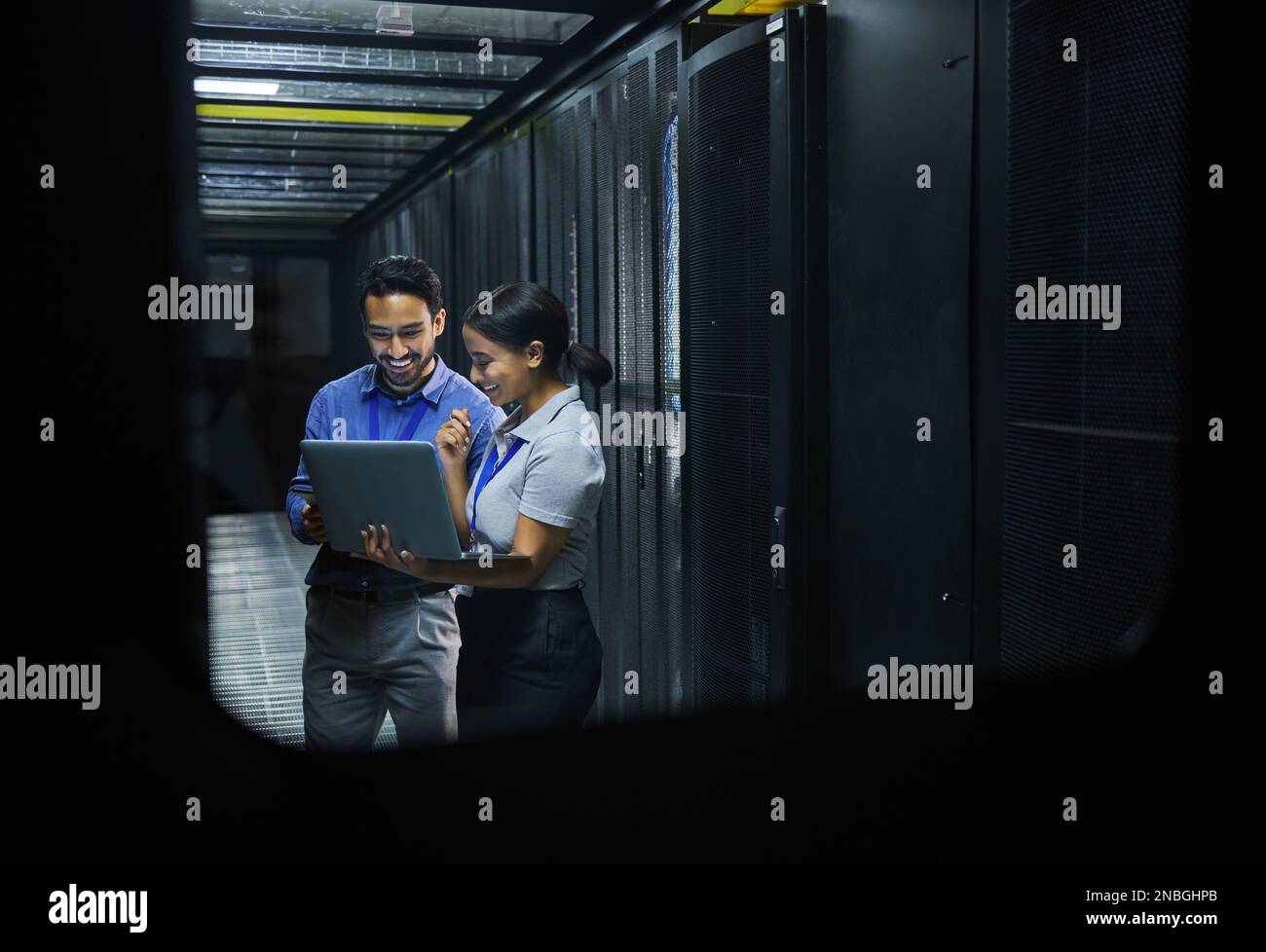 Server room, technician people and laptop for software management, system upgrade or cyber ...