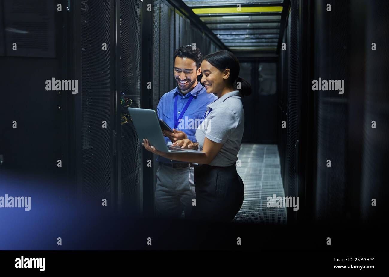 Server room, laptop and technician people for software management, system upgrade or cyber ...