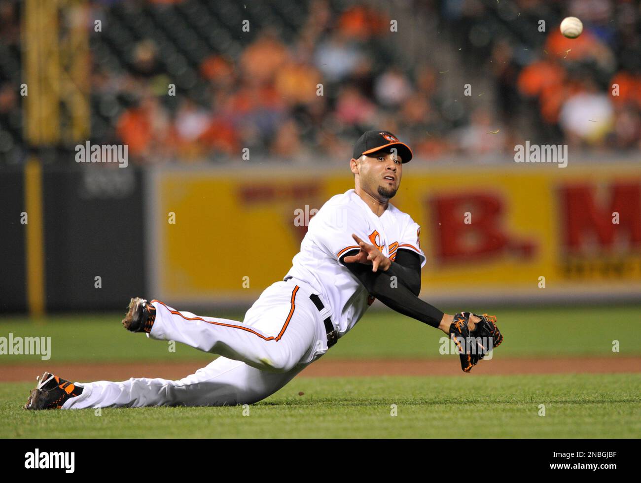 Baltimore Orioles pitcher Michael Gonzalez throws to first to get ...