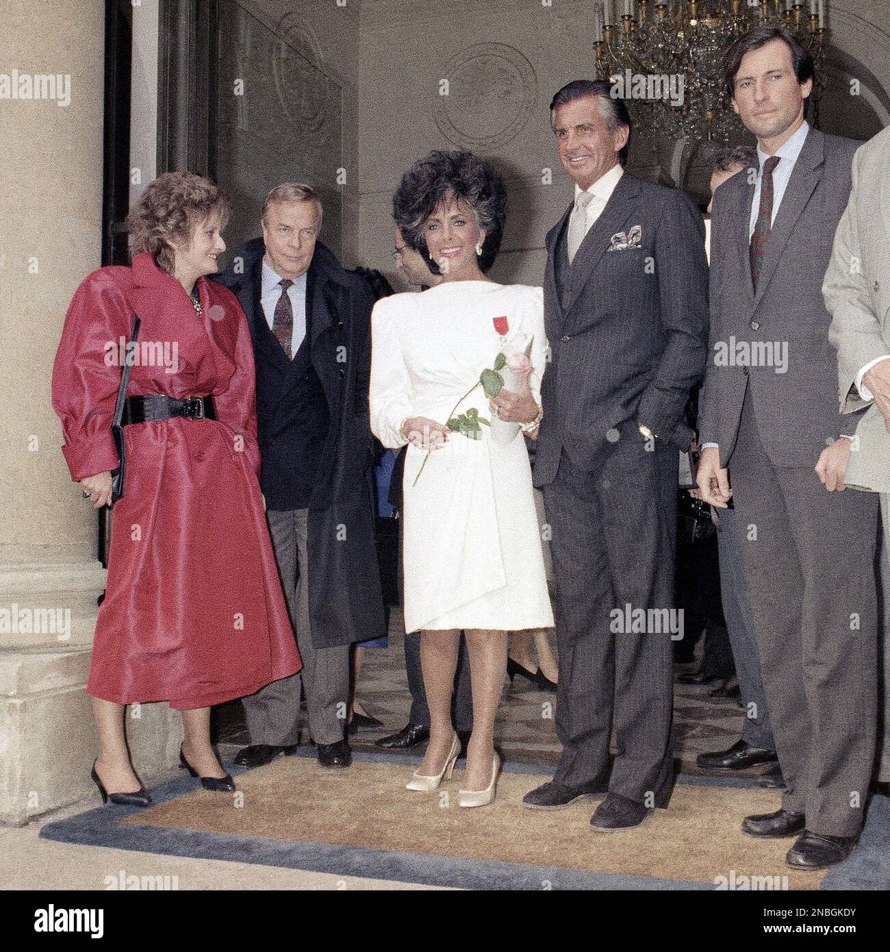 British-born American actress Elizabeth Taylor, third from left, poses ...