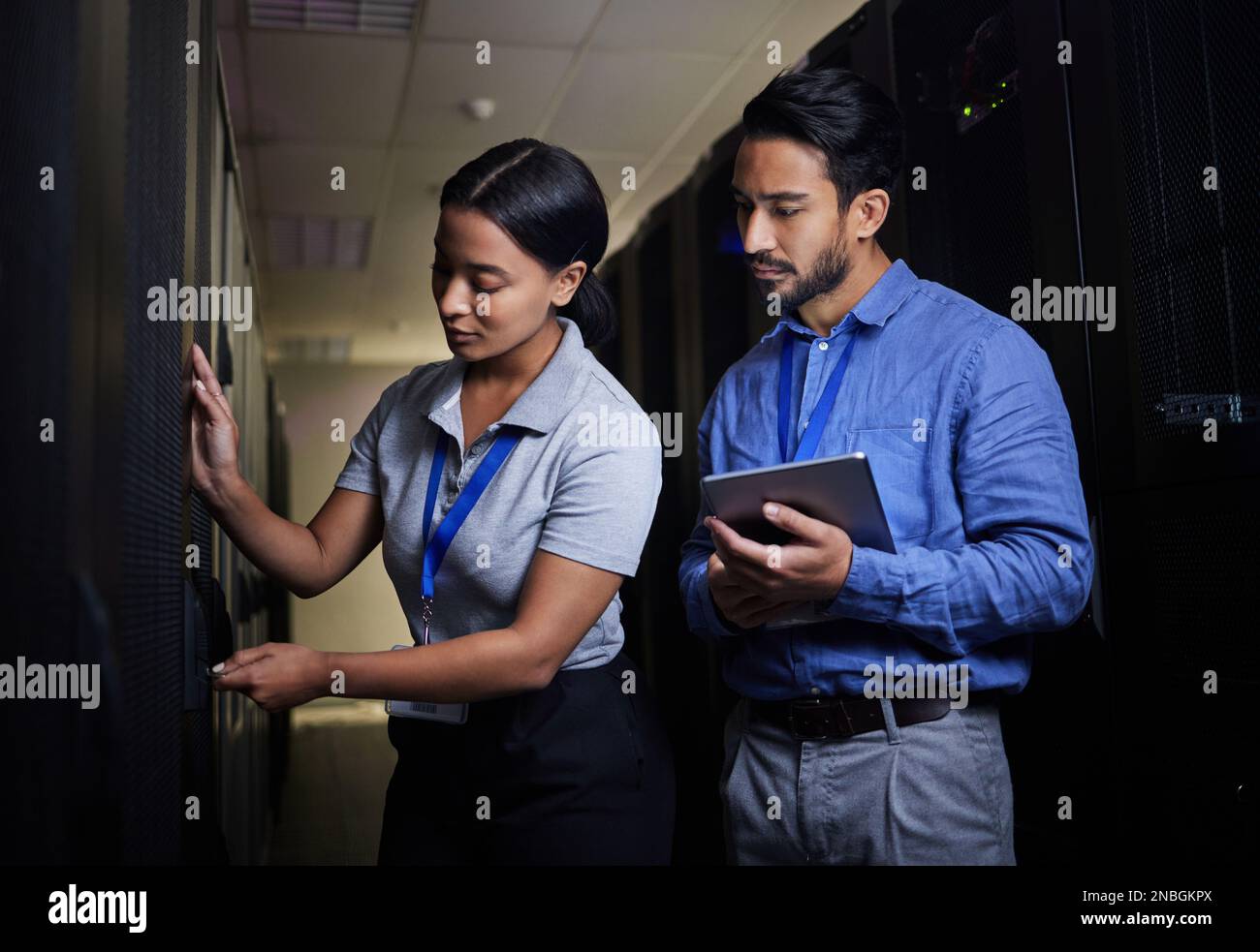 Engineer teamwork, server room and woman opening panel for maintenance ...