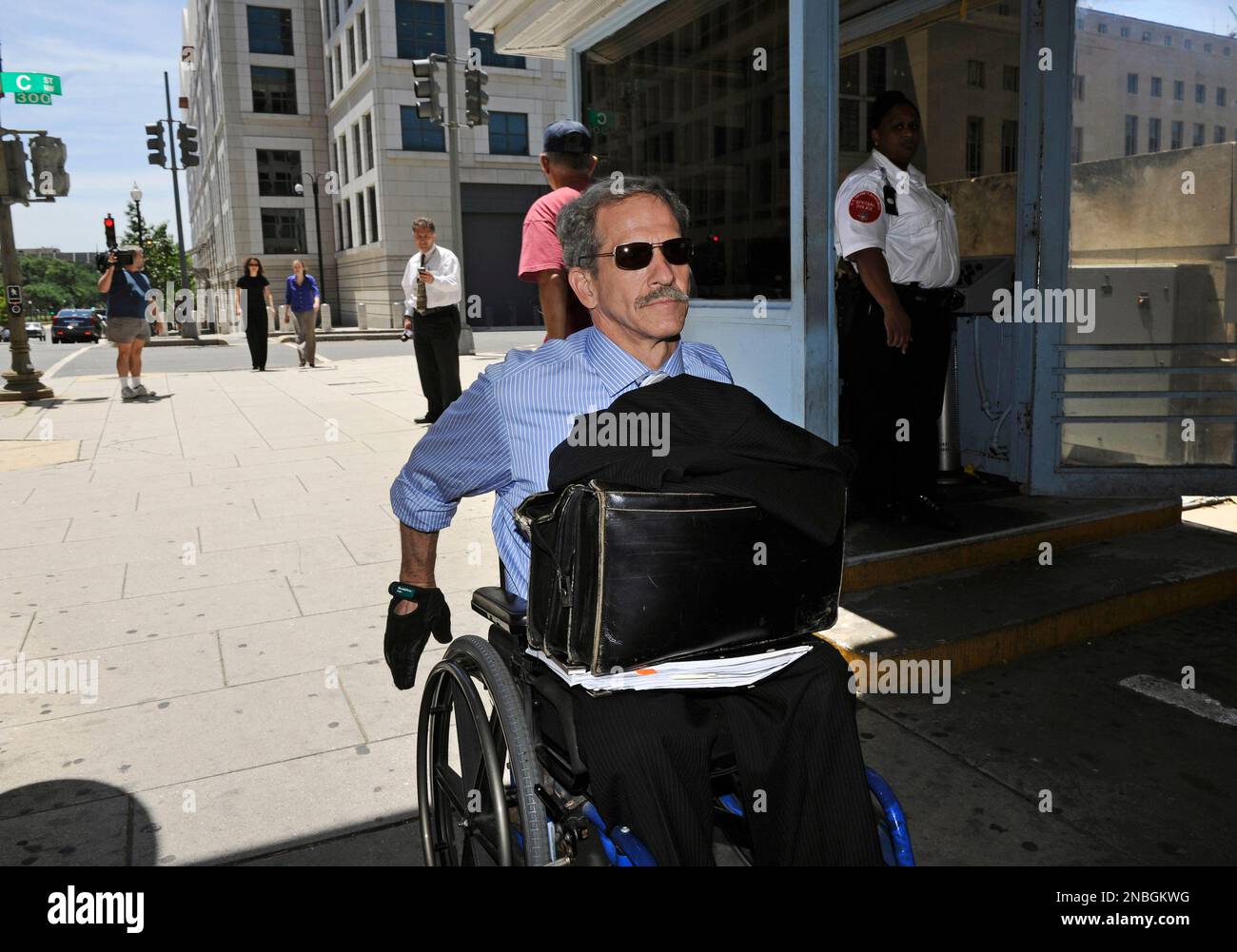 Government prosecutor Daniel Butler leaves the federal court in ...
