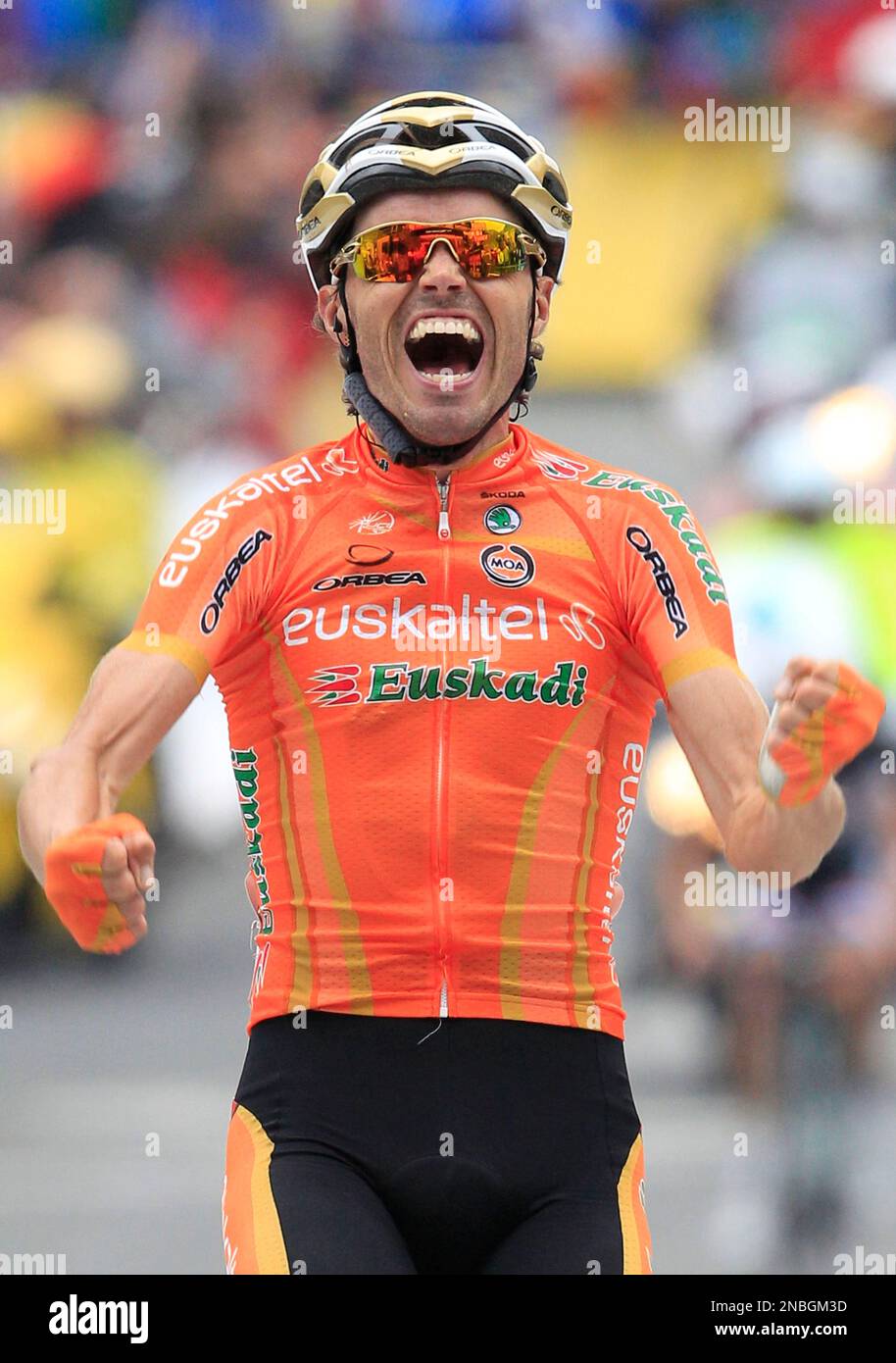 Samuel Sanchez of Spain crosses the finish line to win the 12th stage ...