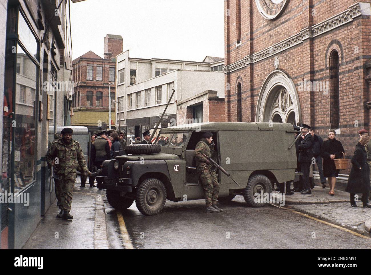 A British army truck is parked across a minor road in Belfast, Northern ...