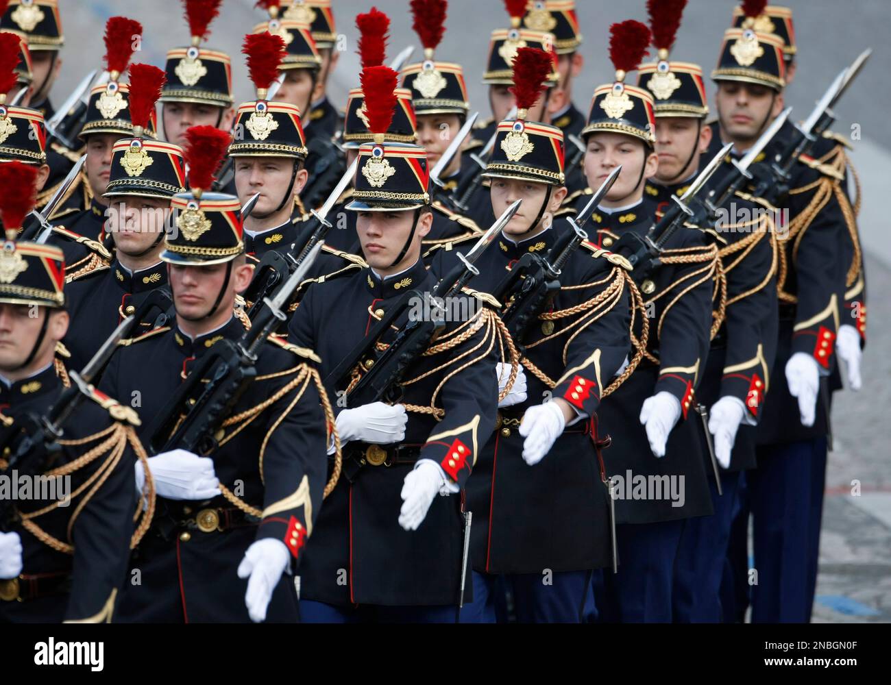 Republican guards parade down the Champs Elysees, during the ...