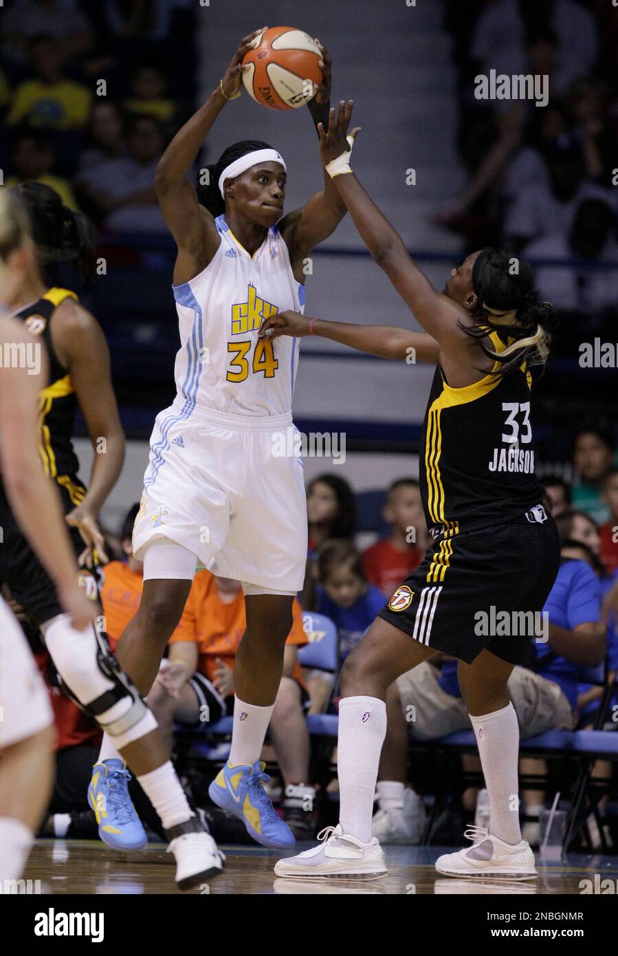 Chicago Sky's Sylvia Fowles, left, passes over Tulsa Shock's Tiffany ...