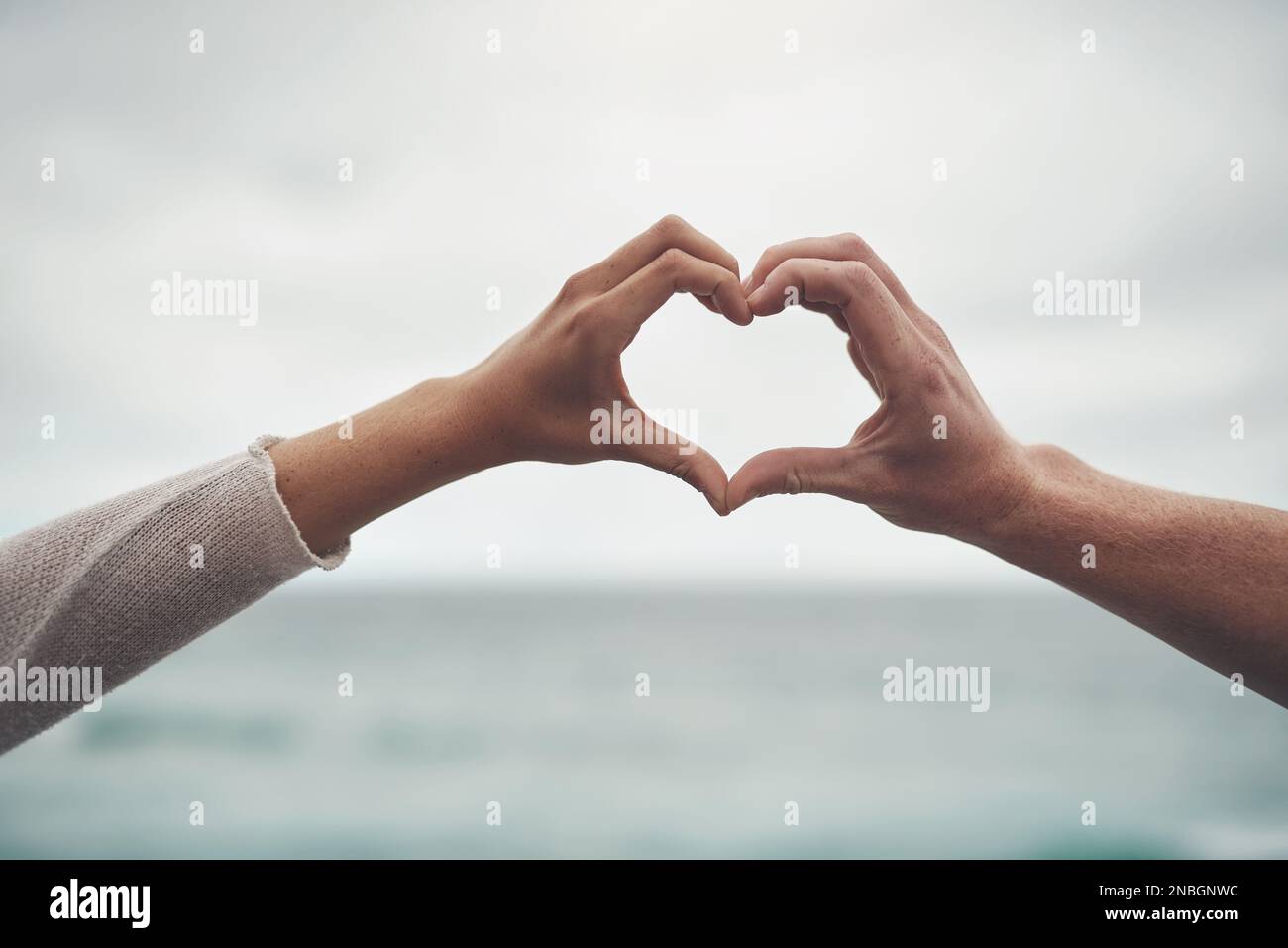 Loving you comes naturally. a couple forming a heart shape with their ...