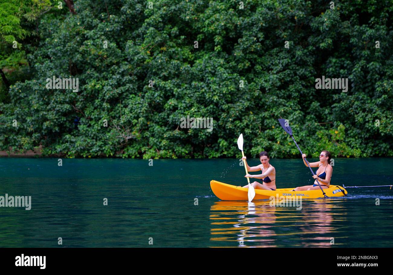 In this picture taken June 24, 2011, tourists paddle in a kayak in the ...