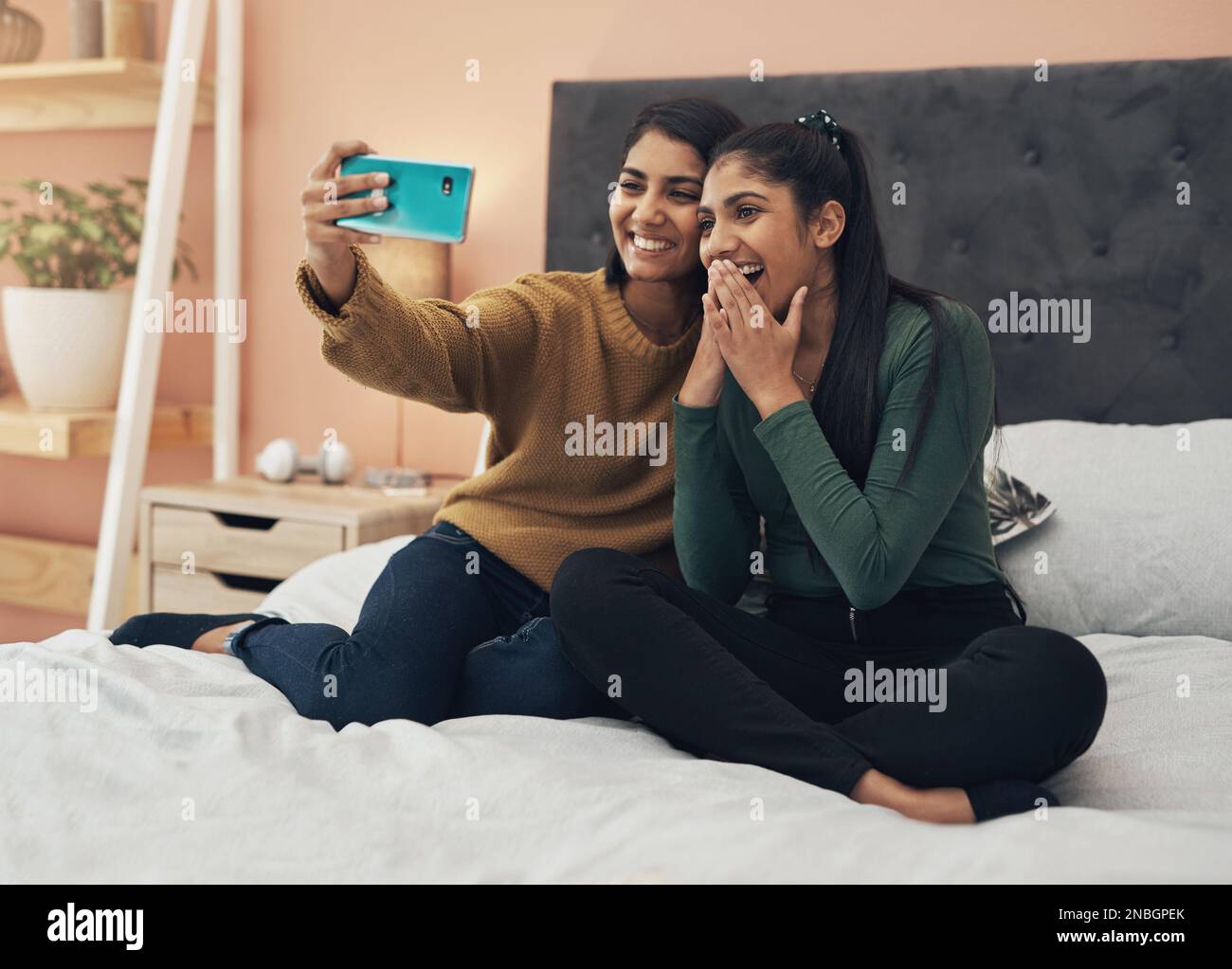 These filters are hilarious. two young women taking a selfie together ...