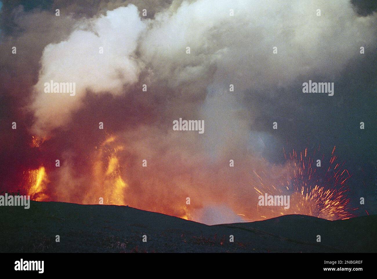 Hot lava, smoke and volcanic ashes burst into the sky as the Mount ...