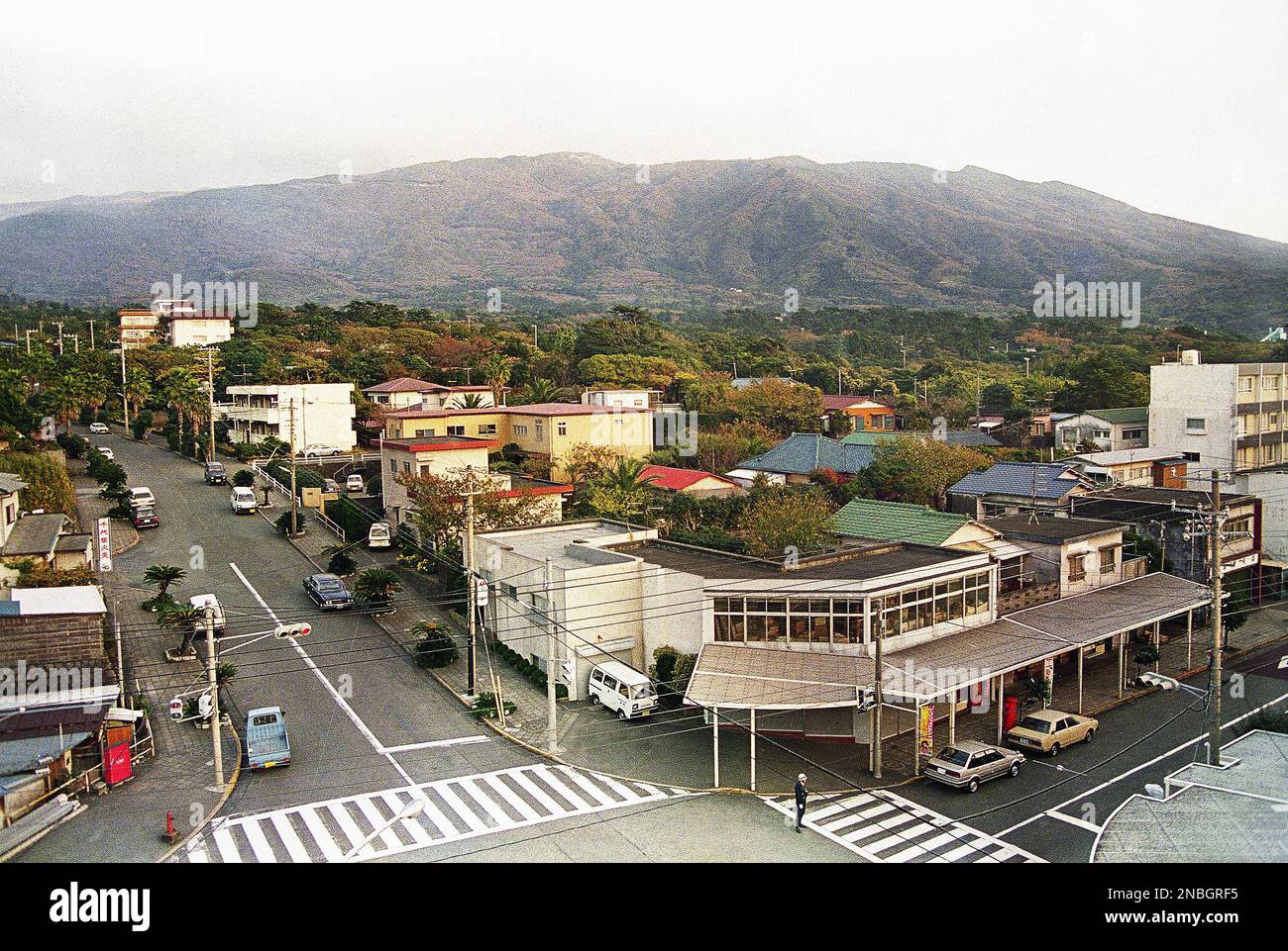 Still active Mount Mihara volcano looms over Motomachi, the most ...