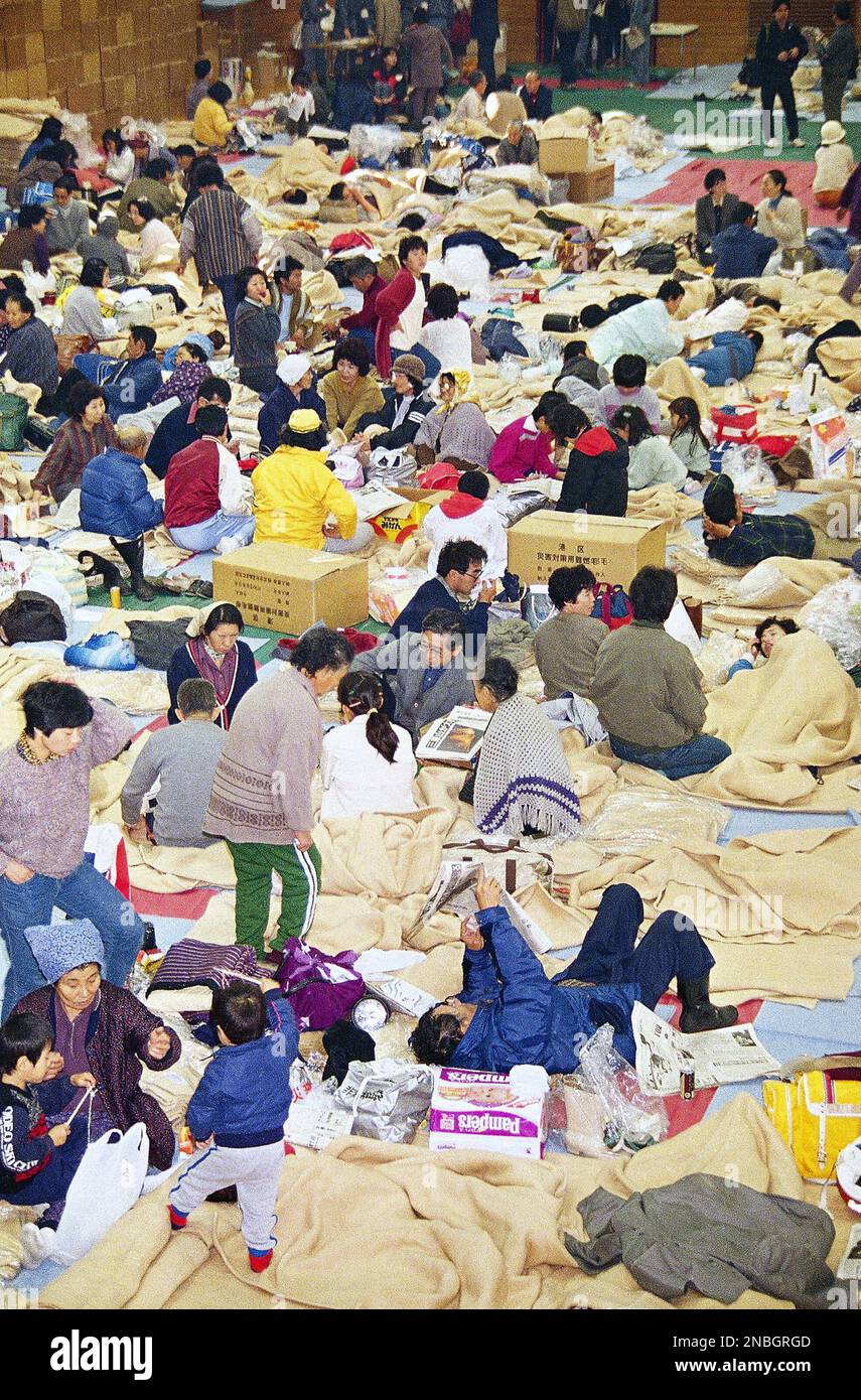 Residents of Oshima Island take shelter in the auditorium of a Tokyo ...