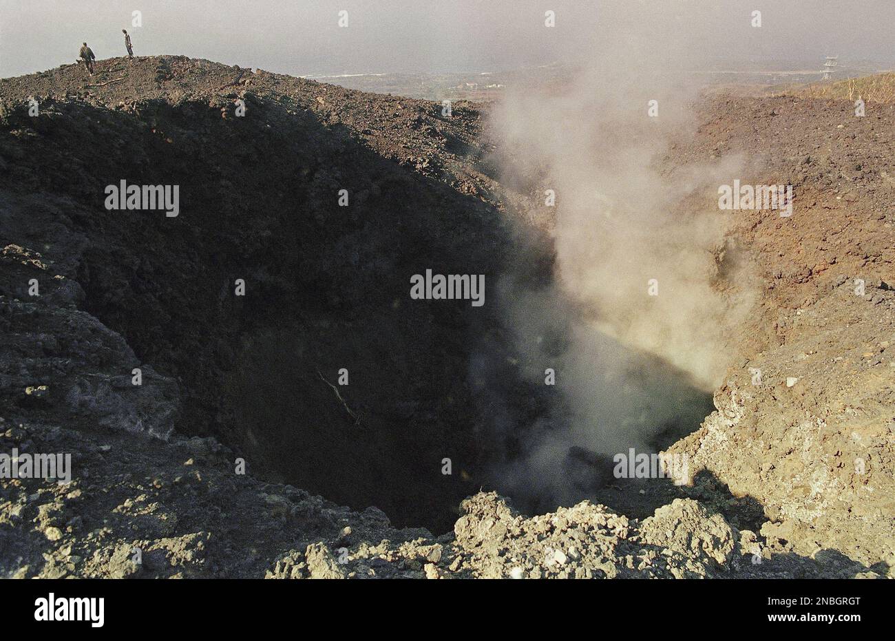 White smoke comes out from a newly-created fissure on Mount Minara, Dec ...