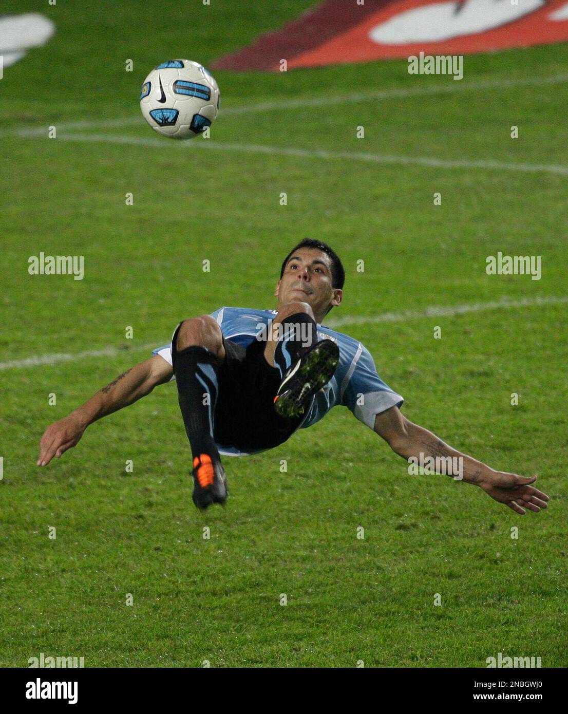 Uruguay's Maximiliano Pereira takes a bicycle kick during a Copa ...