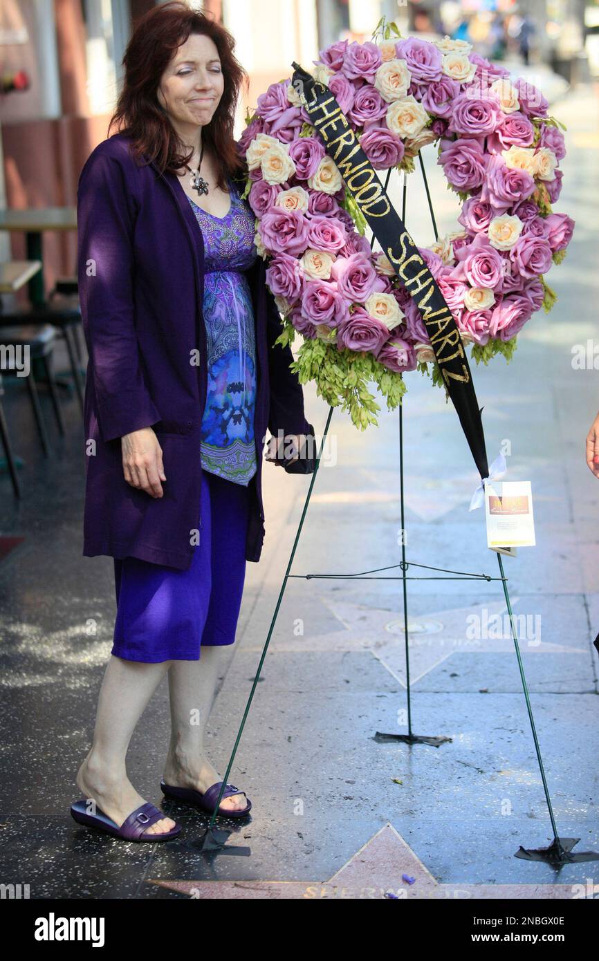 Sherwood Schwartz's great niece, Robin Randall pauses next to flowers ...