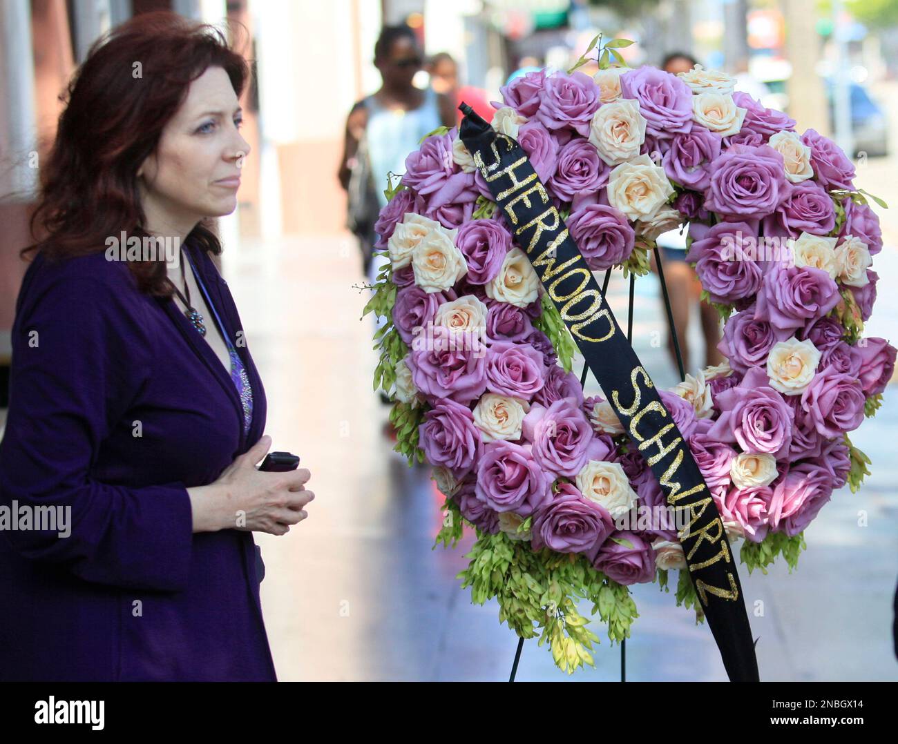 Sherwood Schwartz's great niece, Robin Randall pauses next to flowers ...