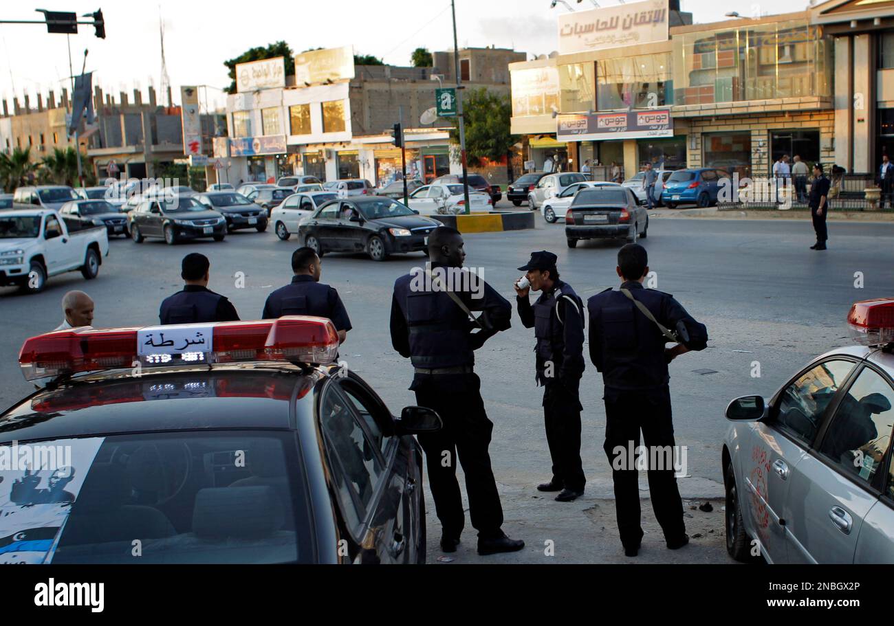 Libyan special emergency police officers seen at the crossroads as they ...