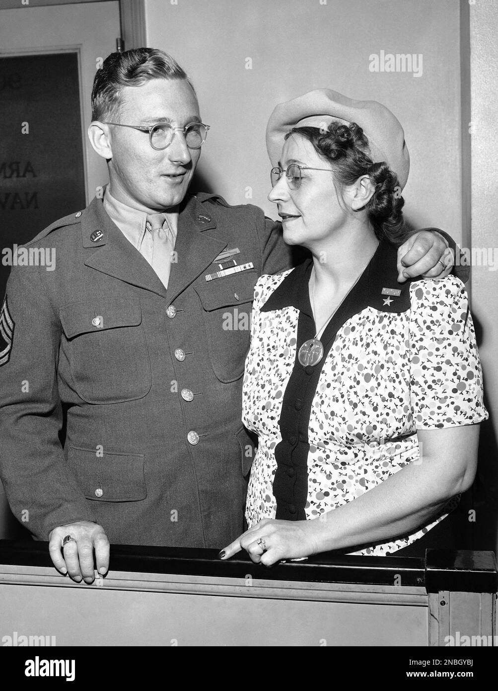 Mrs. Nicholas E. Young, right, of Baltimore, Md., mother of Pvt. Rodger ...