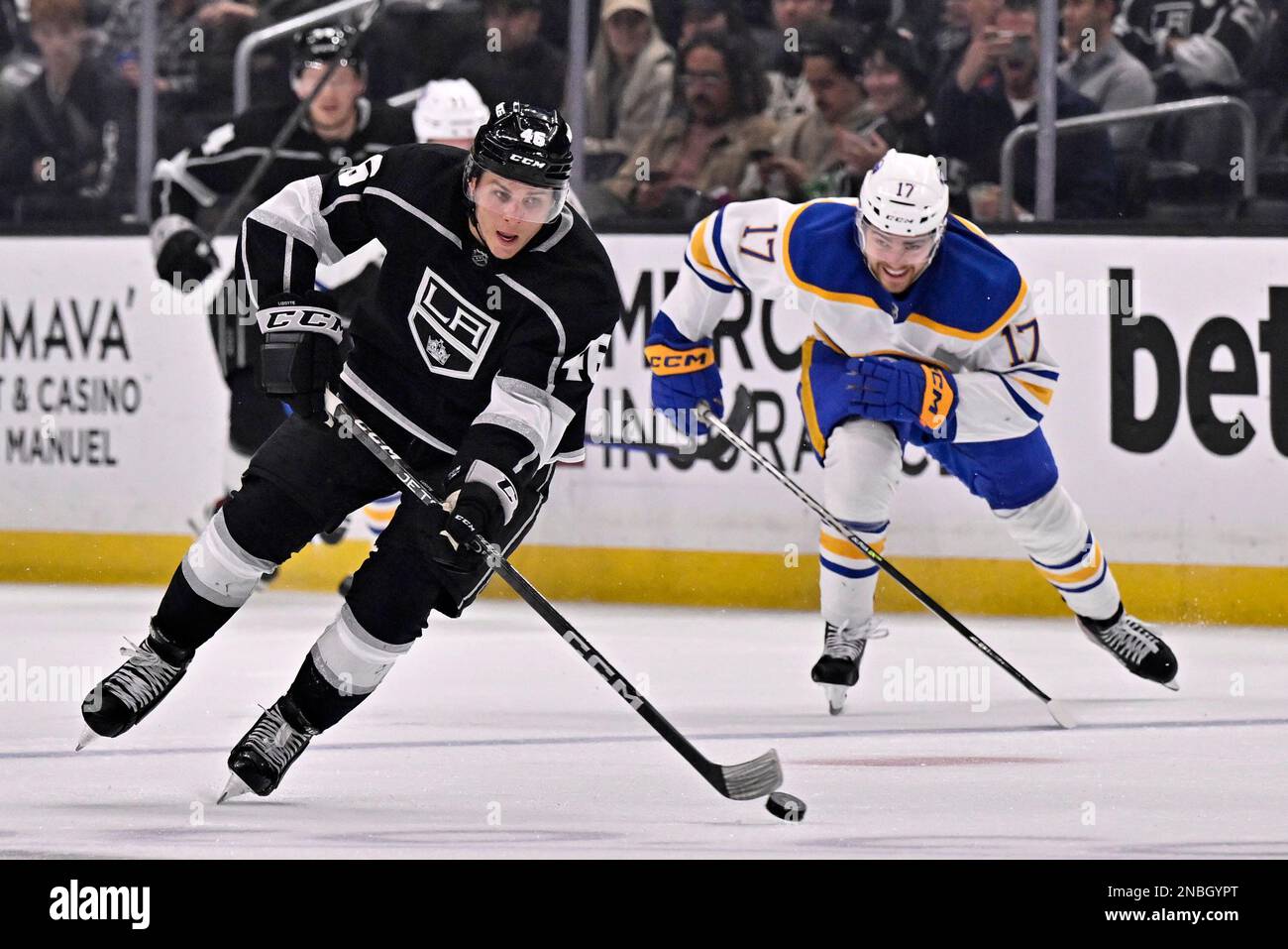 Los Angeles Kings center Blake Lizotte, left, controls the puck with ...