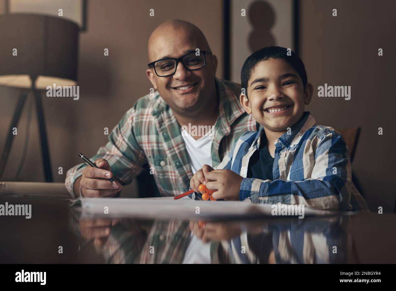 Learning is better when we do it together. Portrait of an adorable ...