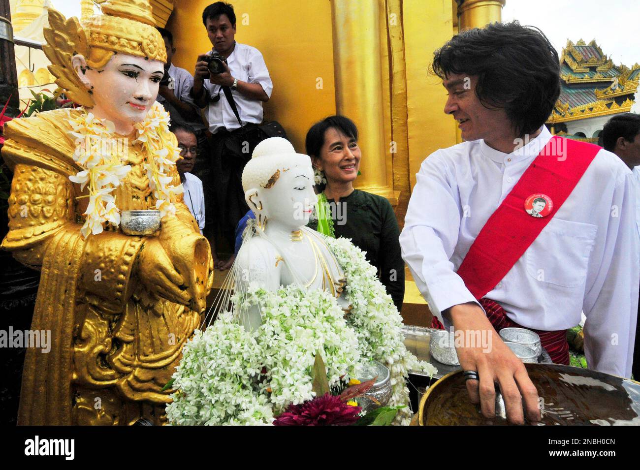 Myanmar democracy icon Aung San Suu Kyi, center, smiles at her youngest ...