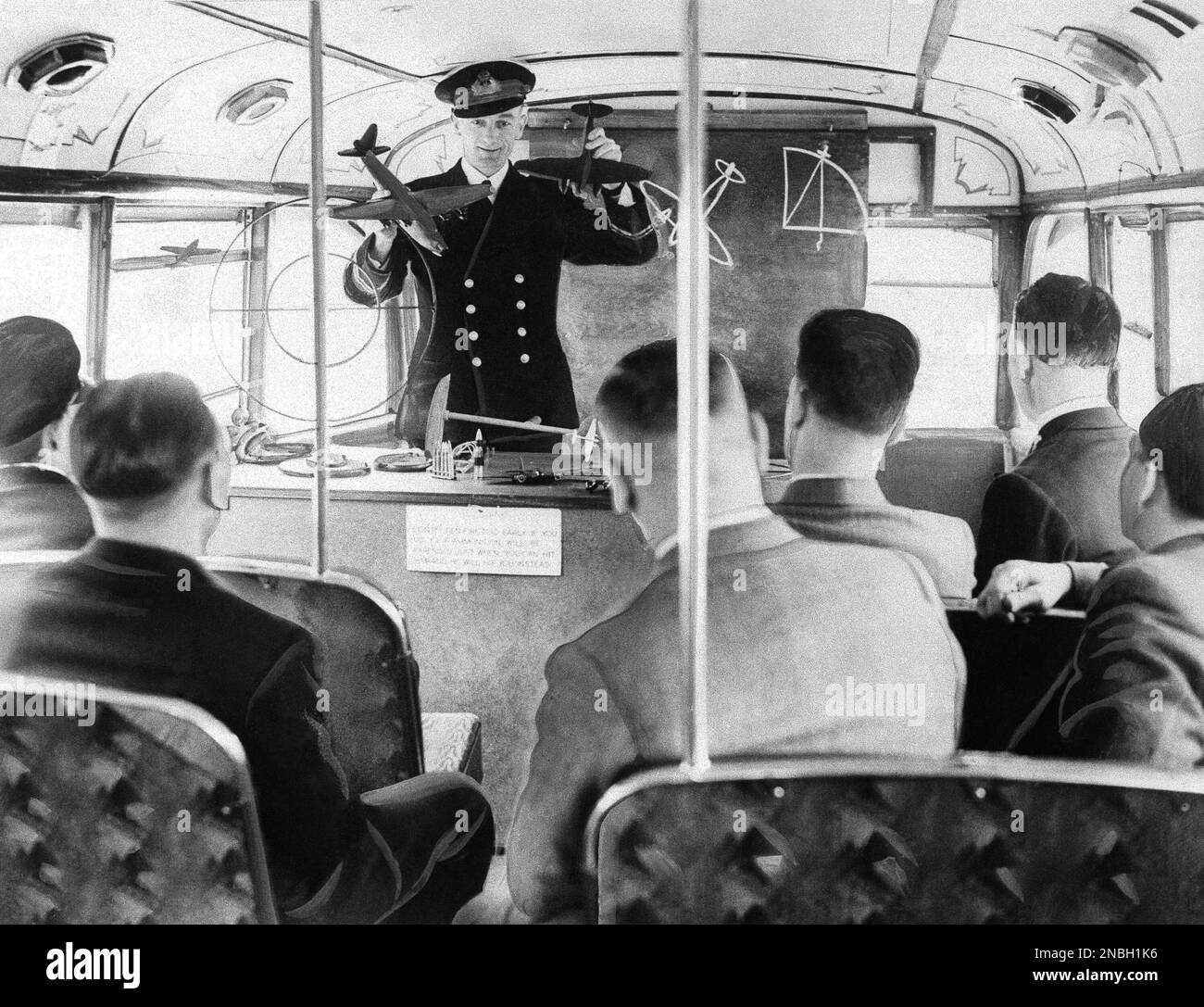 Seamen in the upper deck of a bus which is being used for a mobile ...