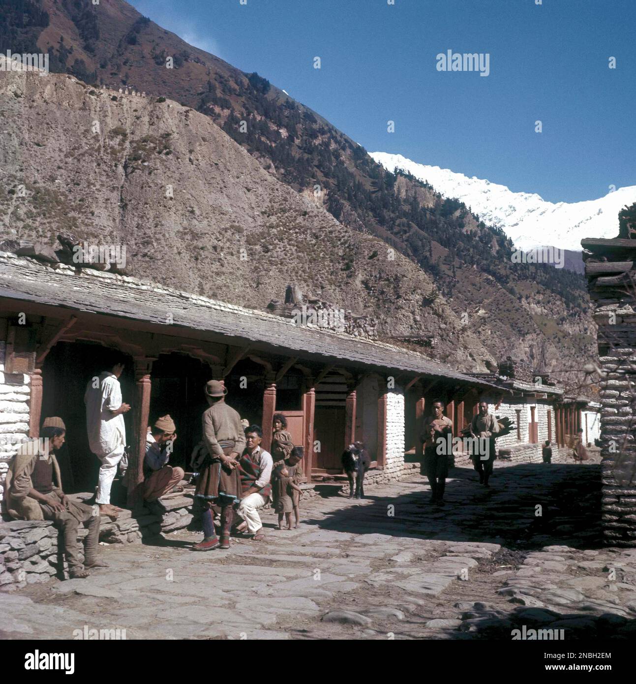 People go about daily life in the Himalayan mountains in Nepal, Oct ...