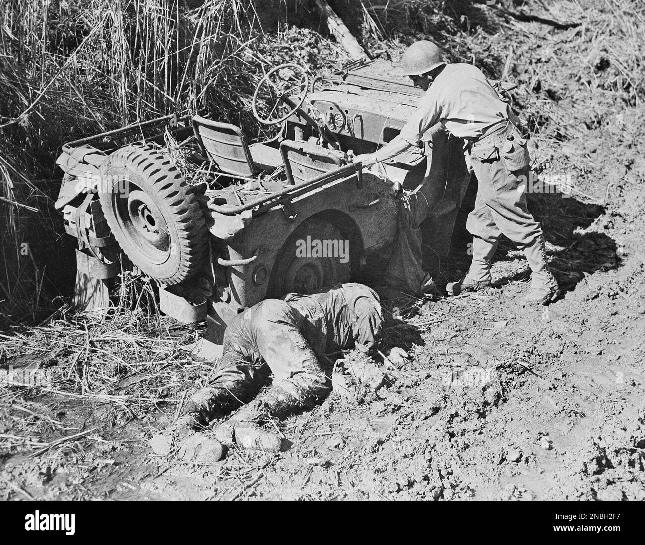**Eds Note: Graphic Content** An American soldier examines a wrecked ...