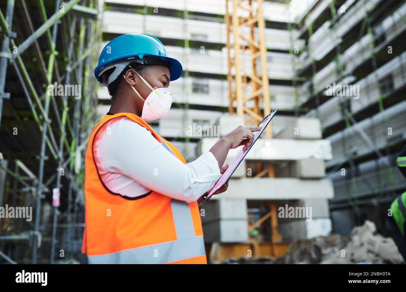Growing the city on a grand scale. a young woman going over building ...