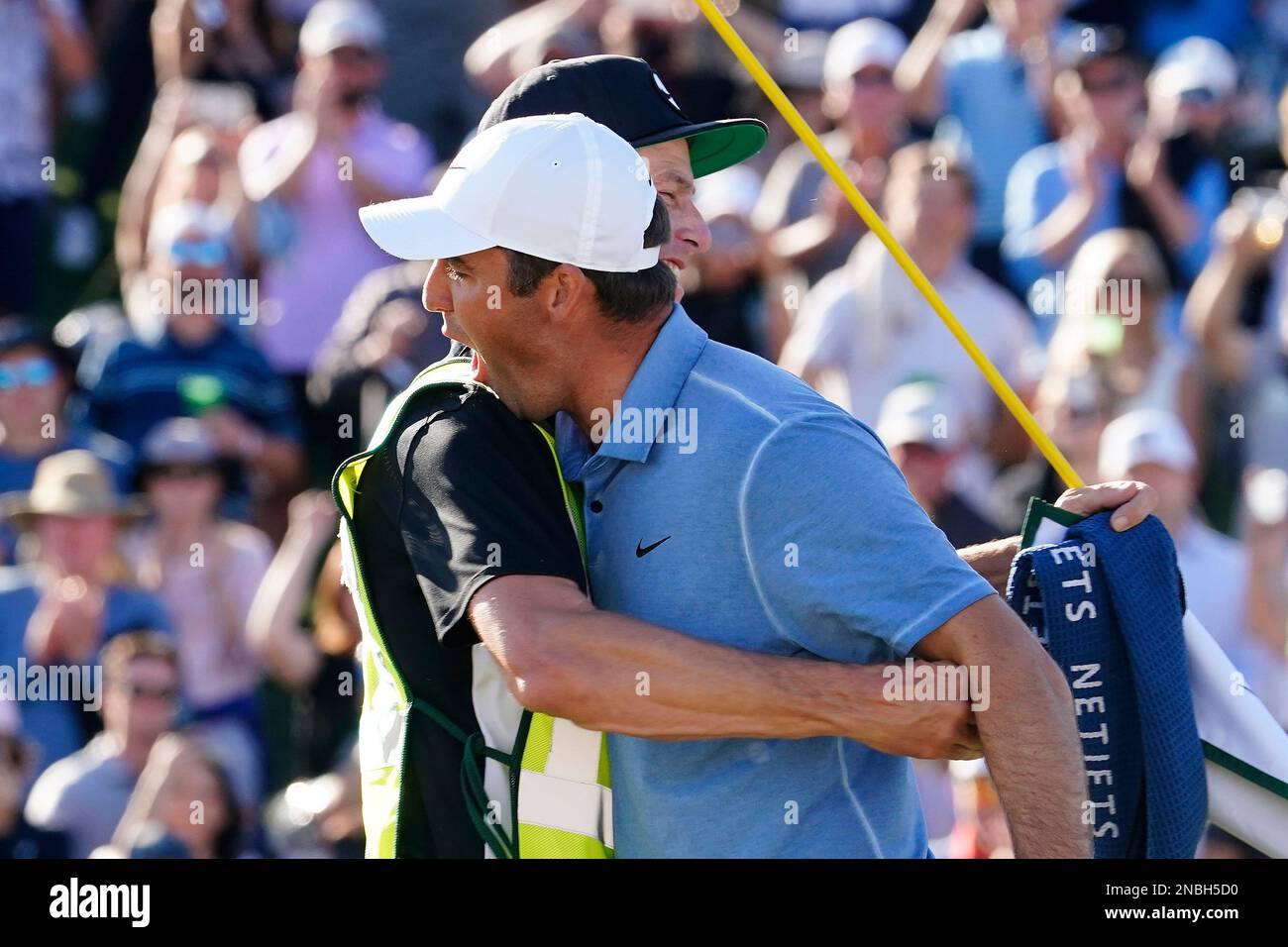 Scottie Scheffler hugs his caddie Ted Scott after winning the Phoenix ...