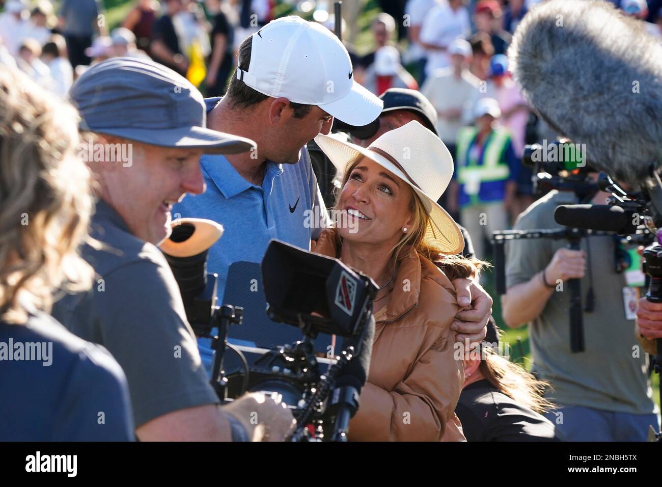 Scottie Scheffler gets a hug from his wife Meredith after winning the ...