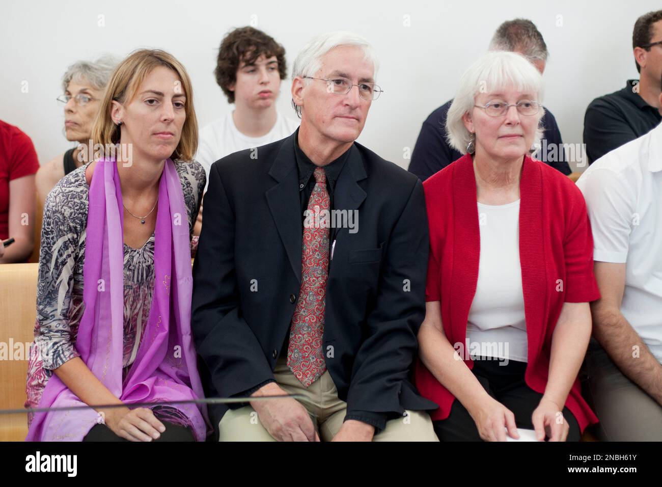 Cindy, right, and Craig Corrie, center, the parents of Rachel Corrie ...