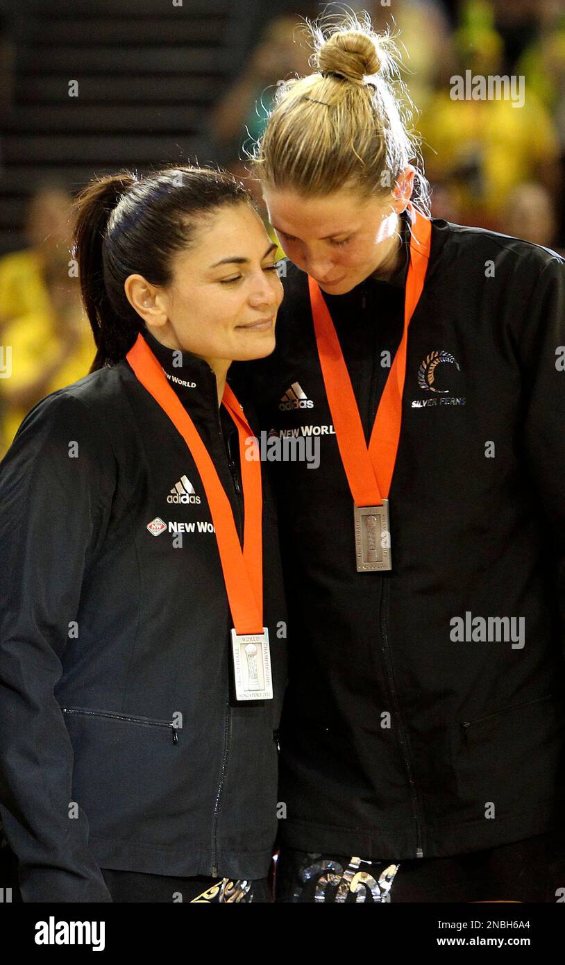 New Zealand's captain Casey Williams, right, comforts teammate Temepara ...