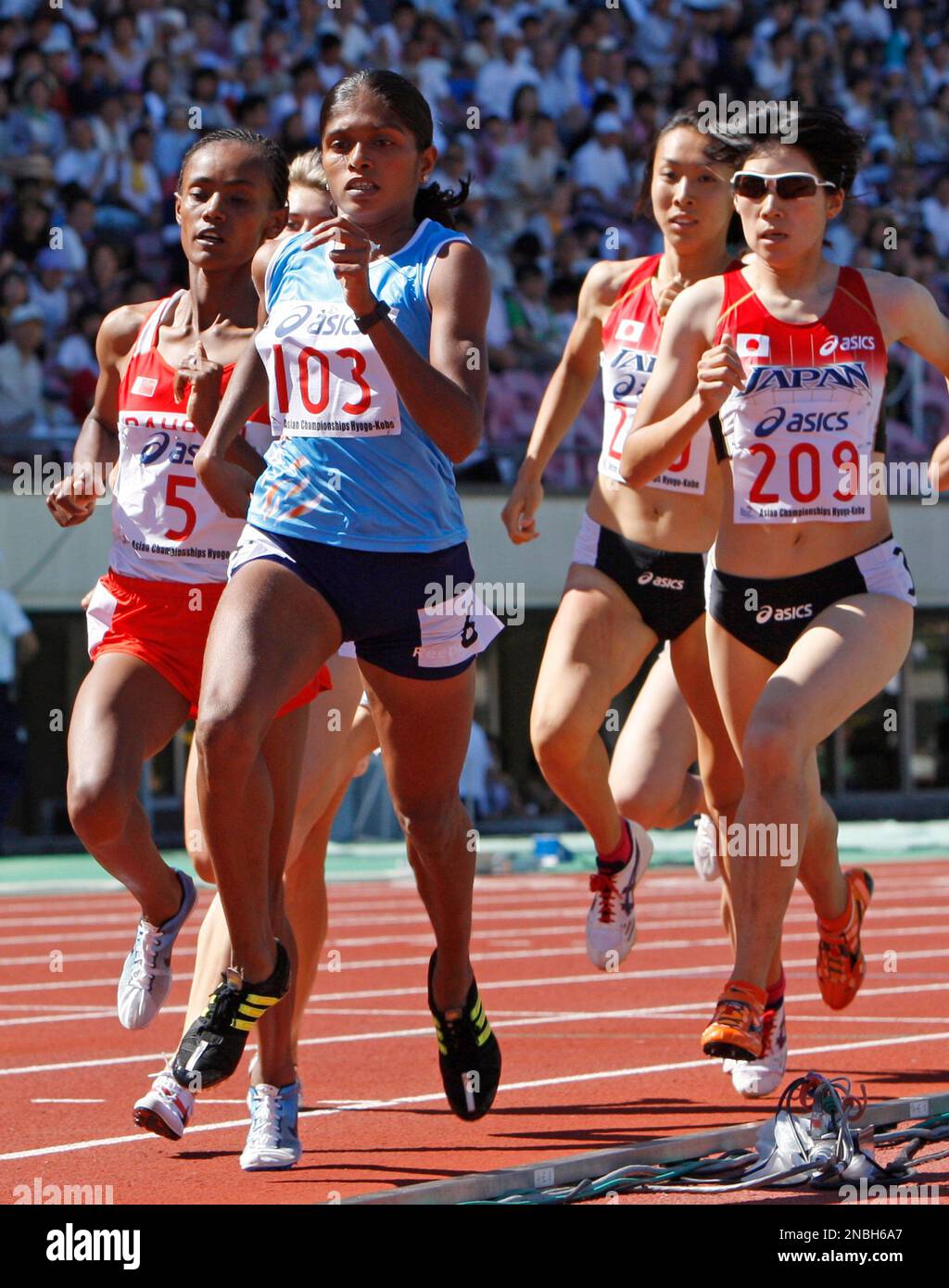 India's Tintu Luka leads the pack on her way to taking the bronze medal ...