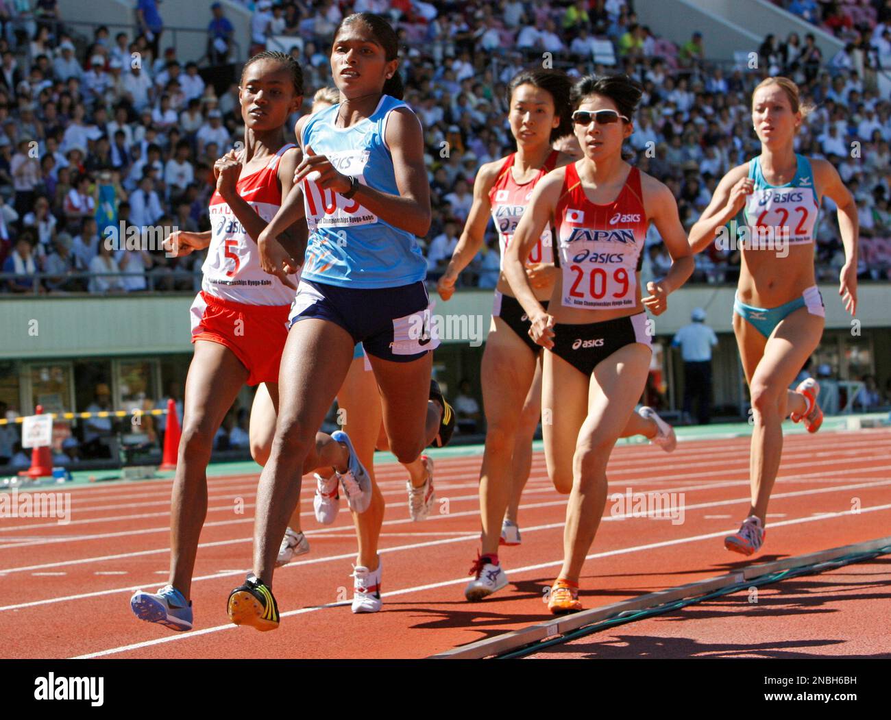 India's Tintu Luka leads the pack on her way to taking the bronze medal ...