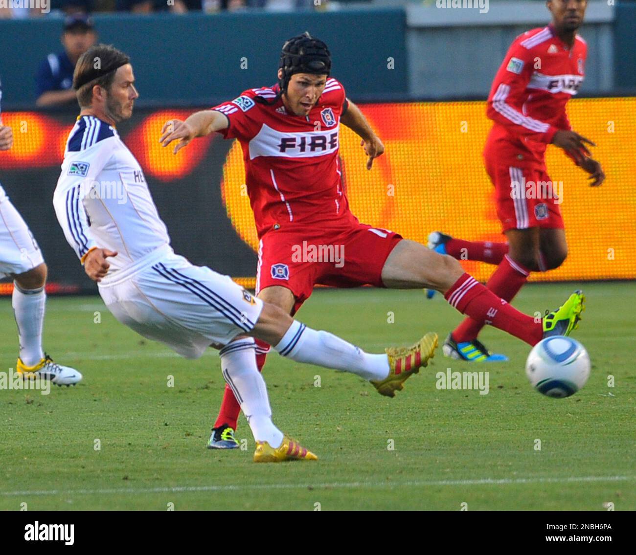 Los Angeles Galaxy midfielder David Beckham, left, passes the ball as ...