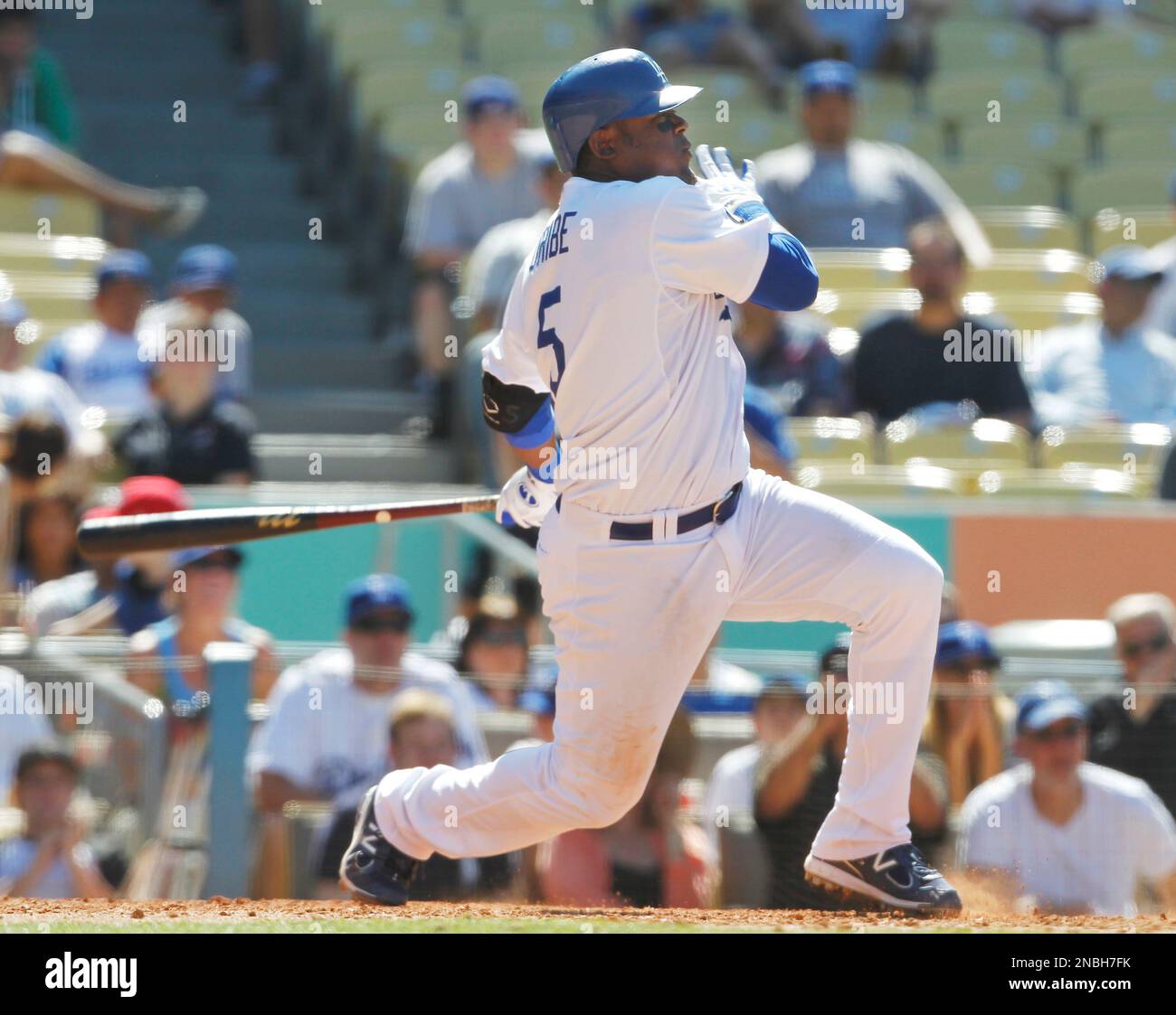 Los Angeles Dodgers Juan Uribe hits a double in the ninth inning of a ...