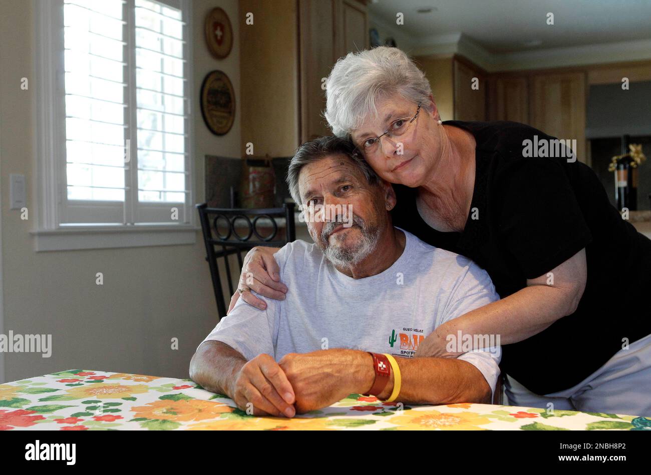 Pius 'Pete" Zuger poses for a photograph with his wife Jackie at their ...