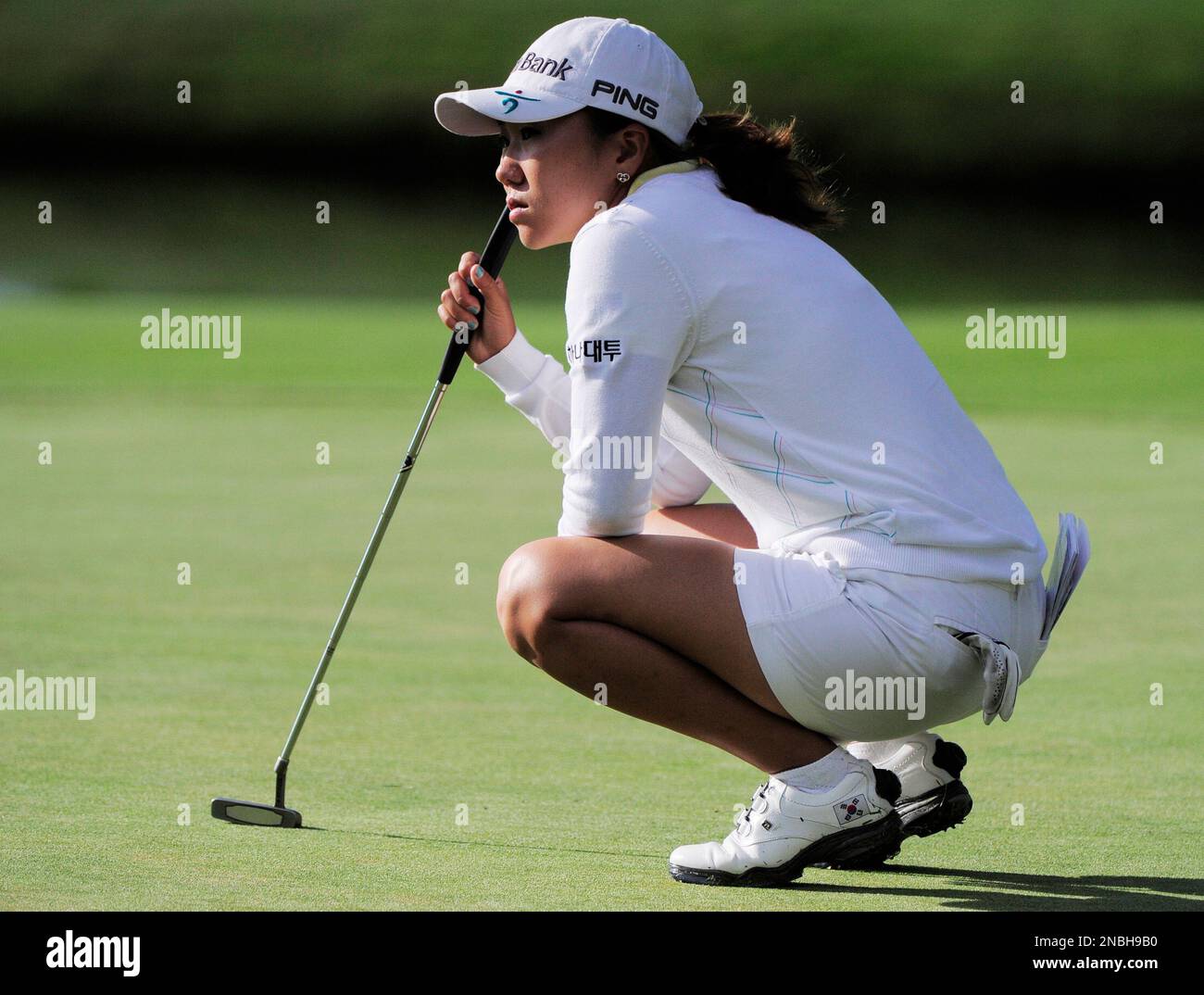 I. K. Kim of South Korea waits to putt on the 18th hole as she finishes ...