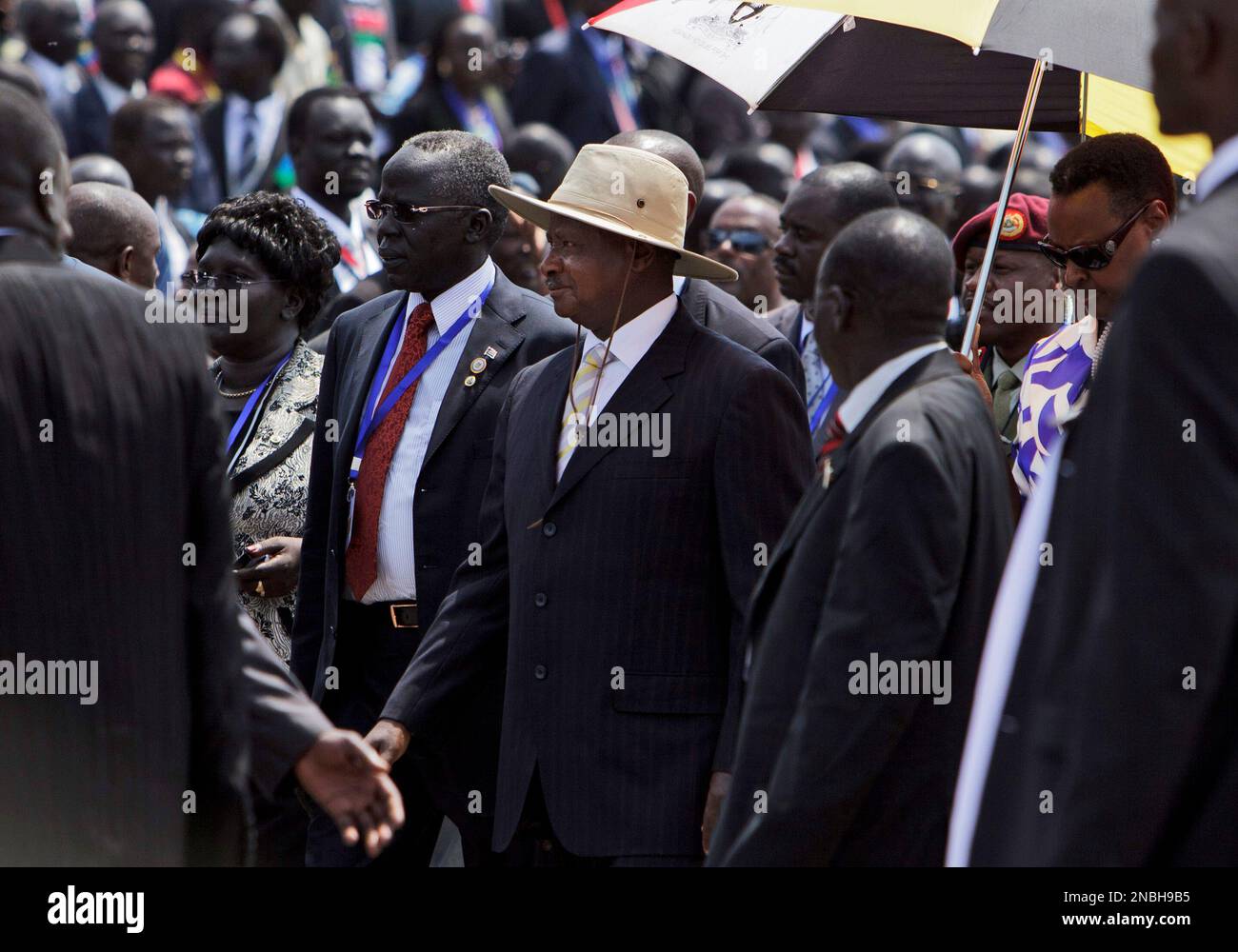Ugandan President Yoweri Museveni, center, arrives for independence ...