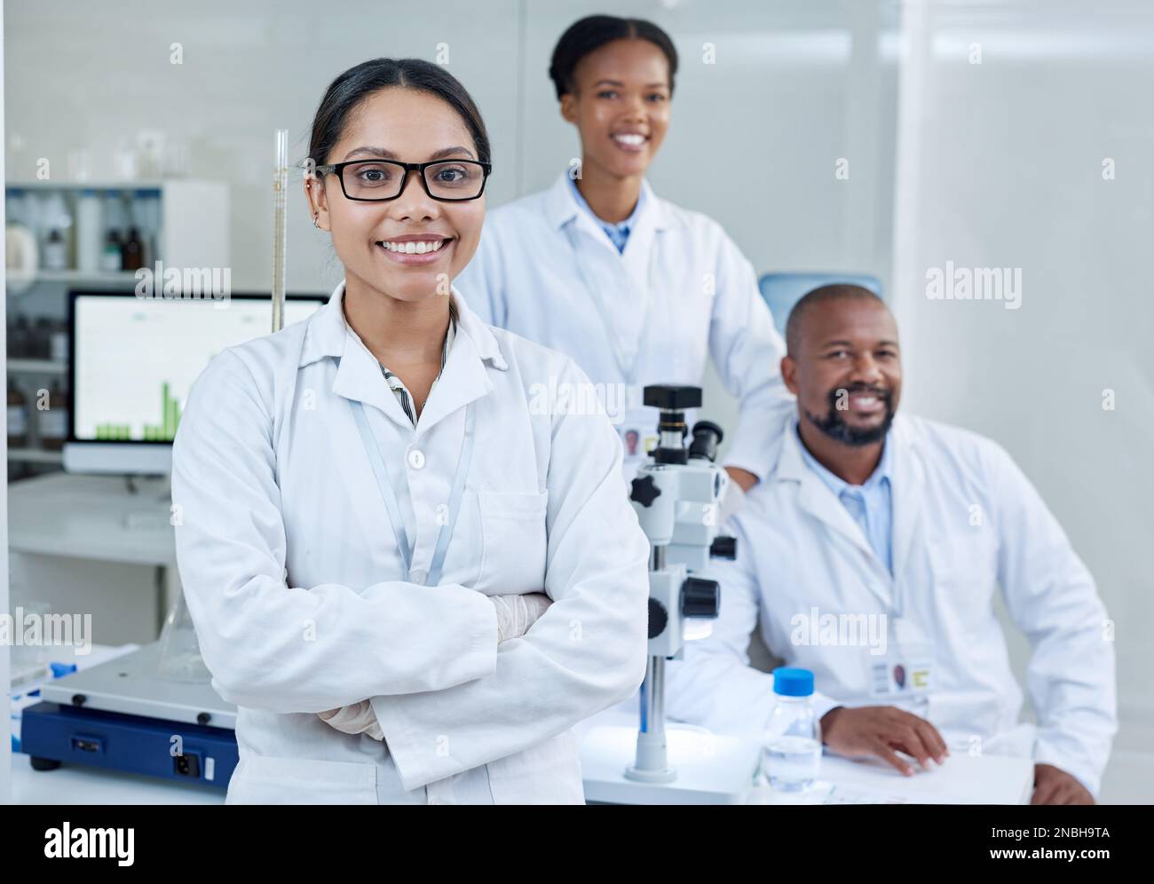 Confident team of scientists in the lab hi-res stock photography and ...