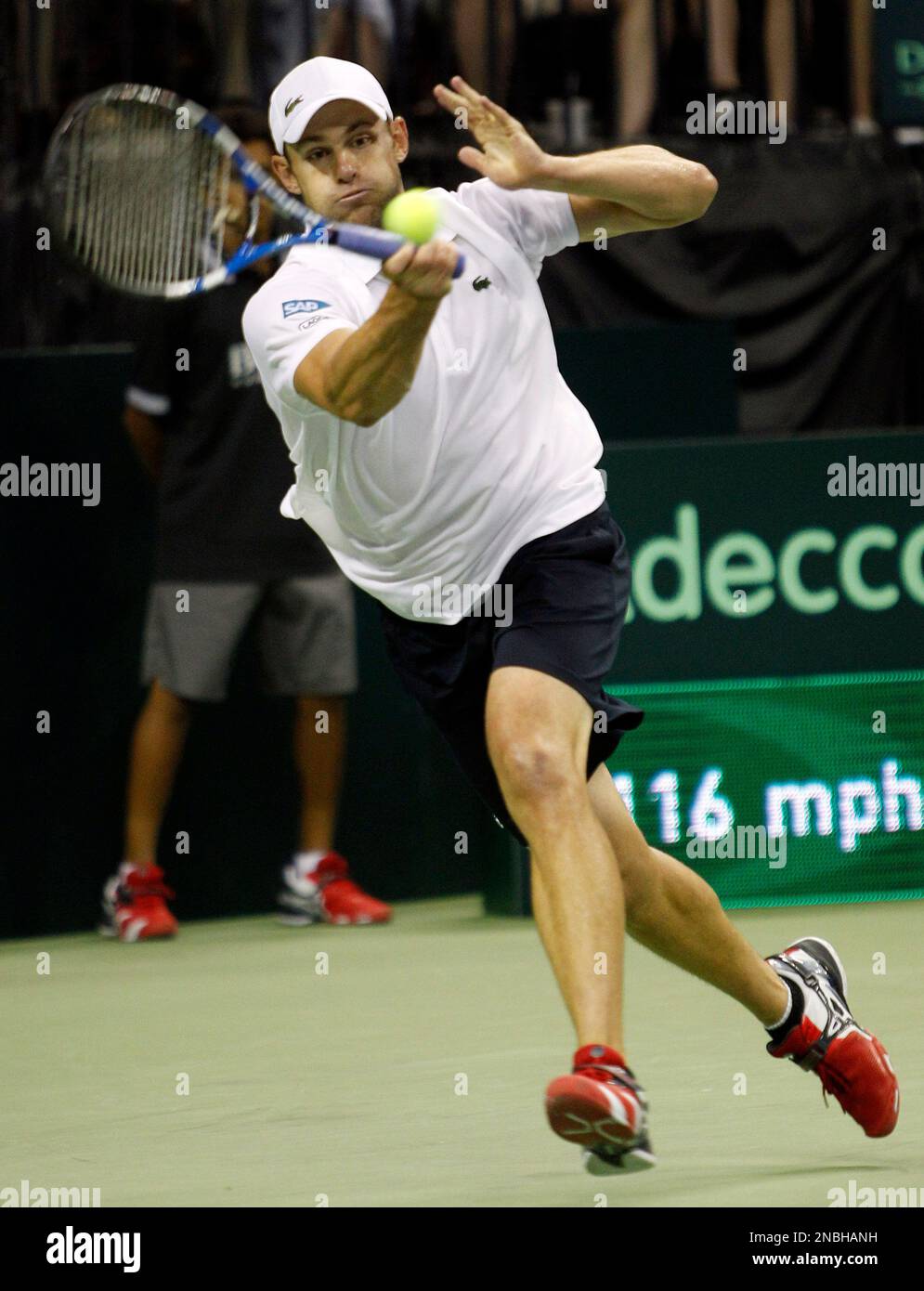 Andy Roddick of the U.S. returns the ball to David Ferrer of Spain ...
