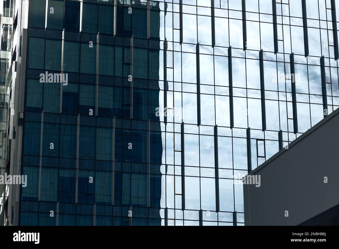 The geometry of modern urban architecture is reflected in the glass ...